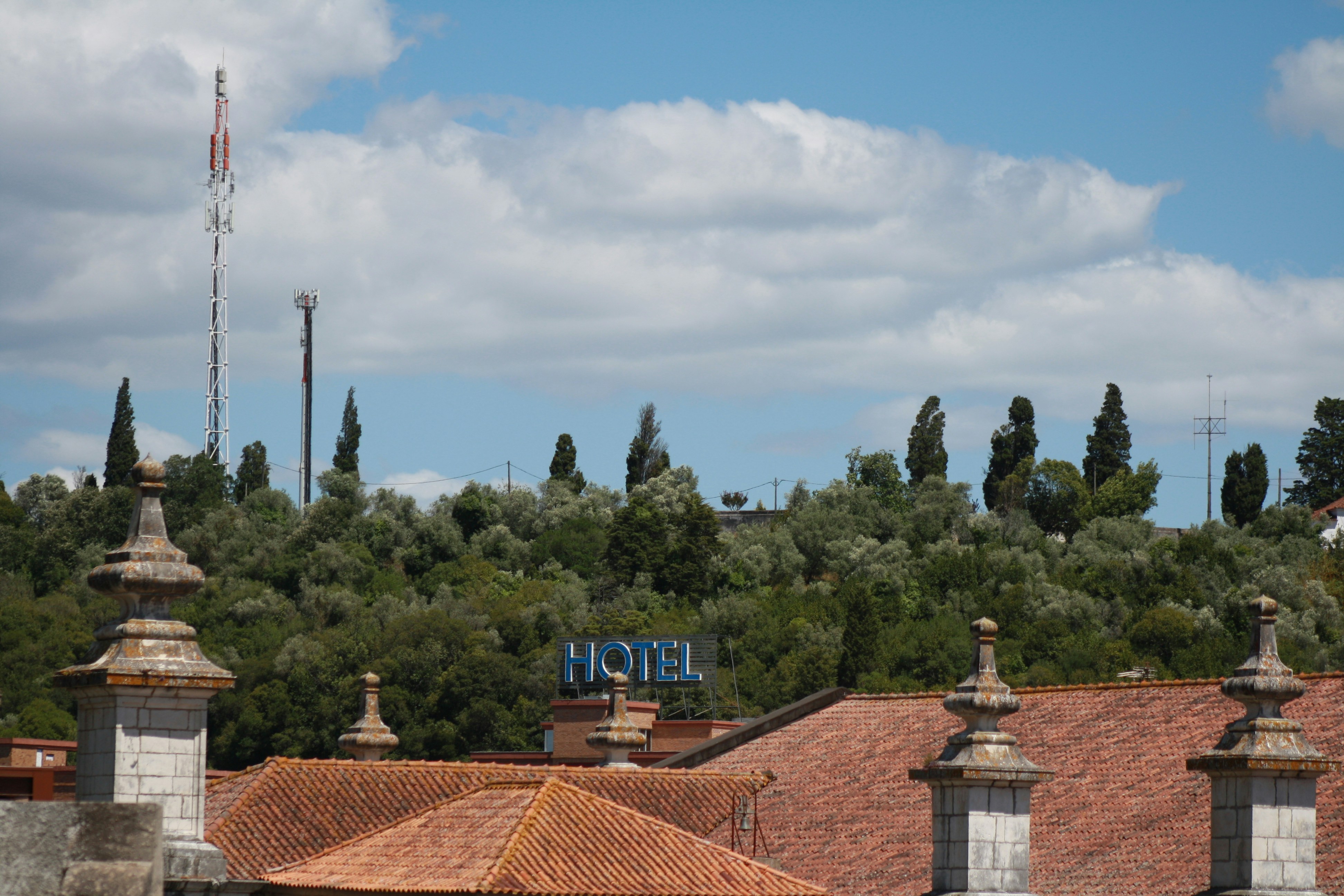 a rooftop with trees and a sign