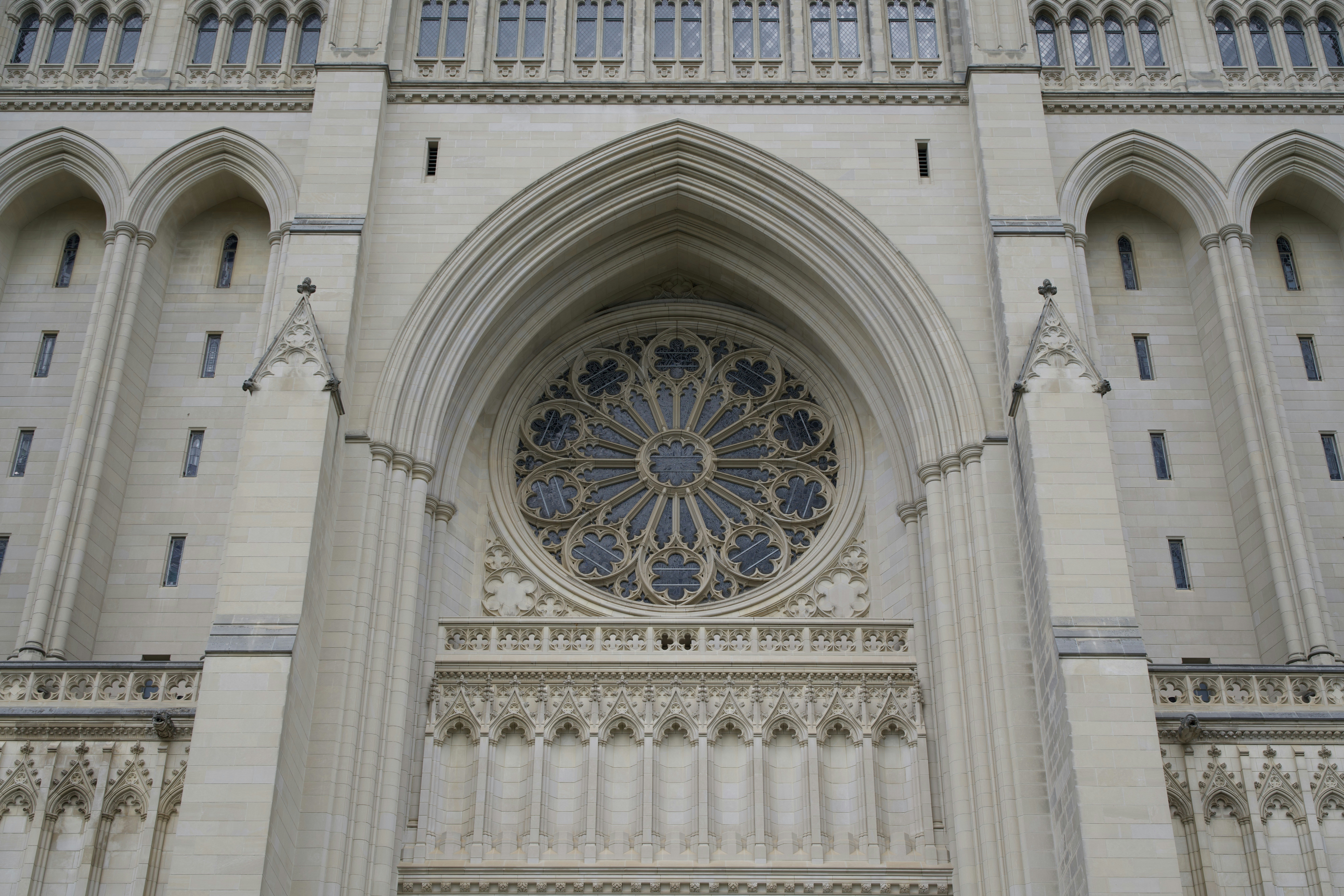 A large building with a large arched doorway photo – Free Grey Image on ...