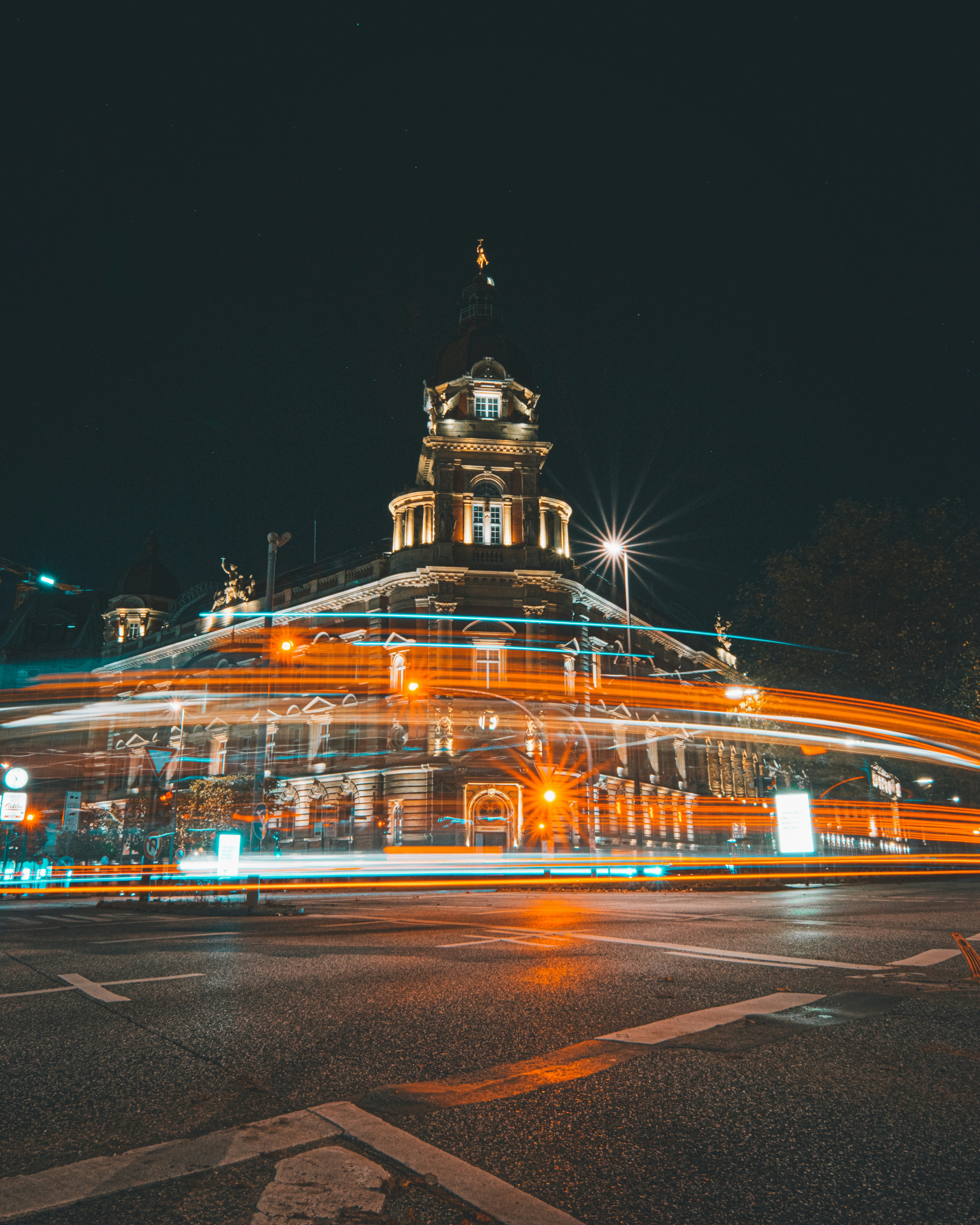A lit up city at night photo – Free Brown Image on Unsplash