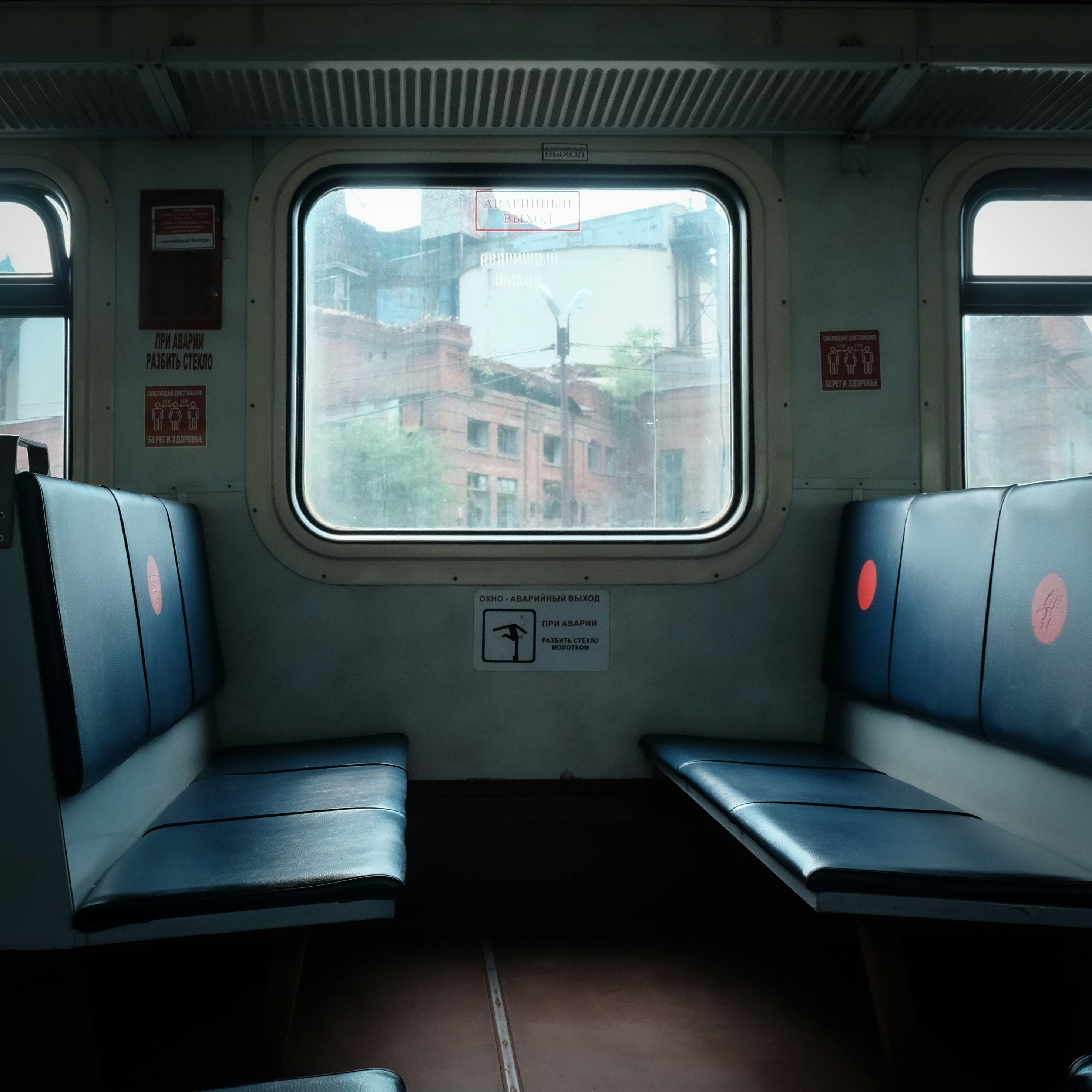 Brick Facades Through a Quiet Commuter Car Window