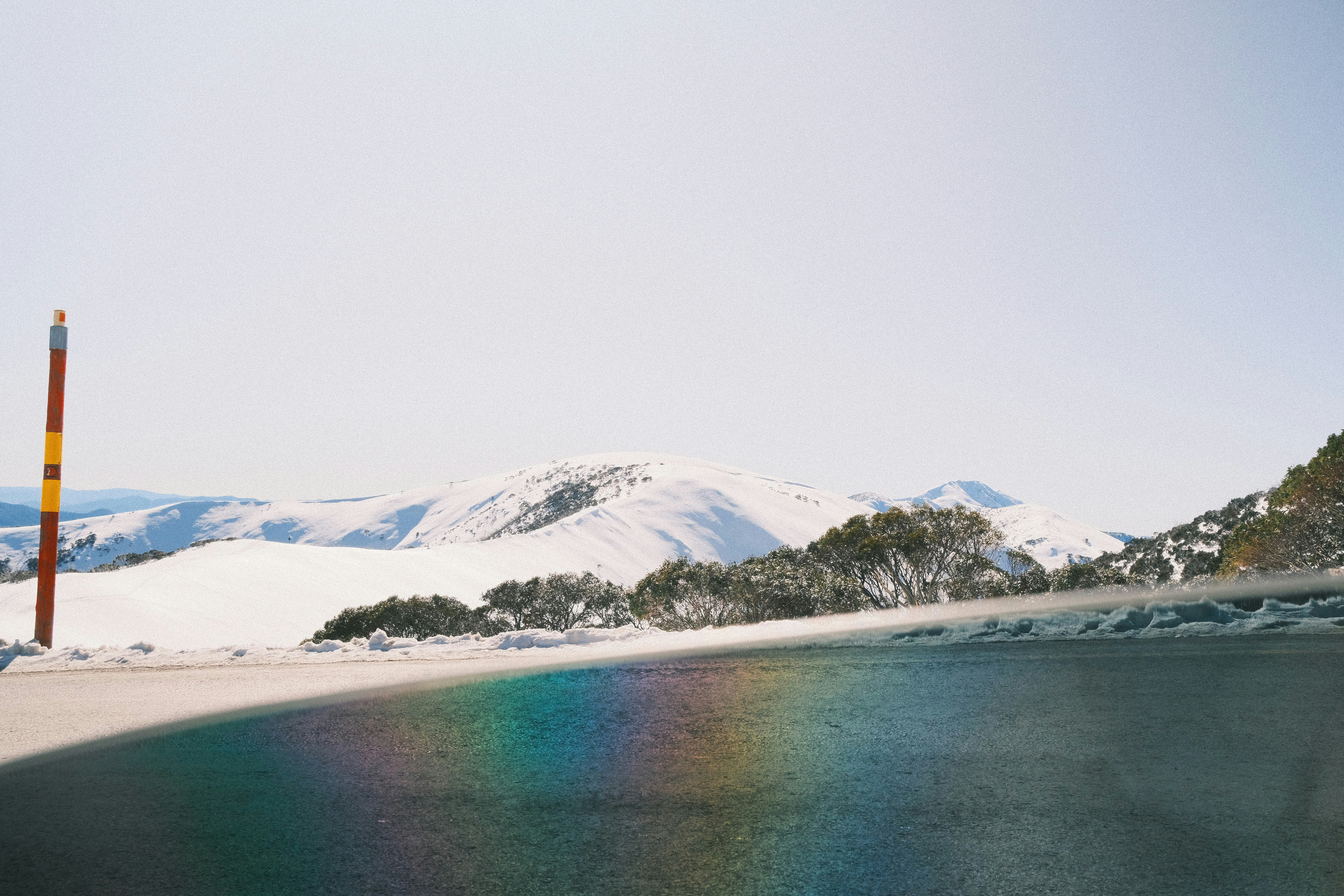 Rainbow Reflections over Polar Snow Fields