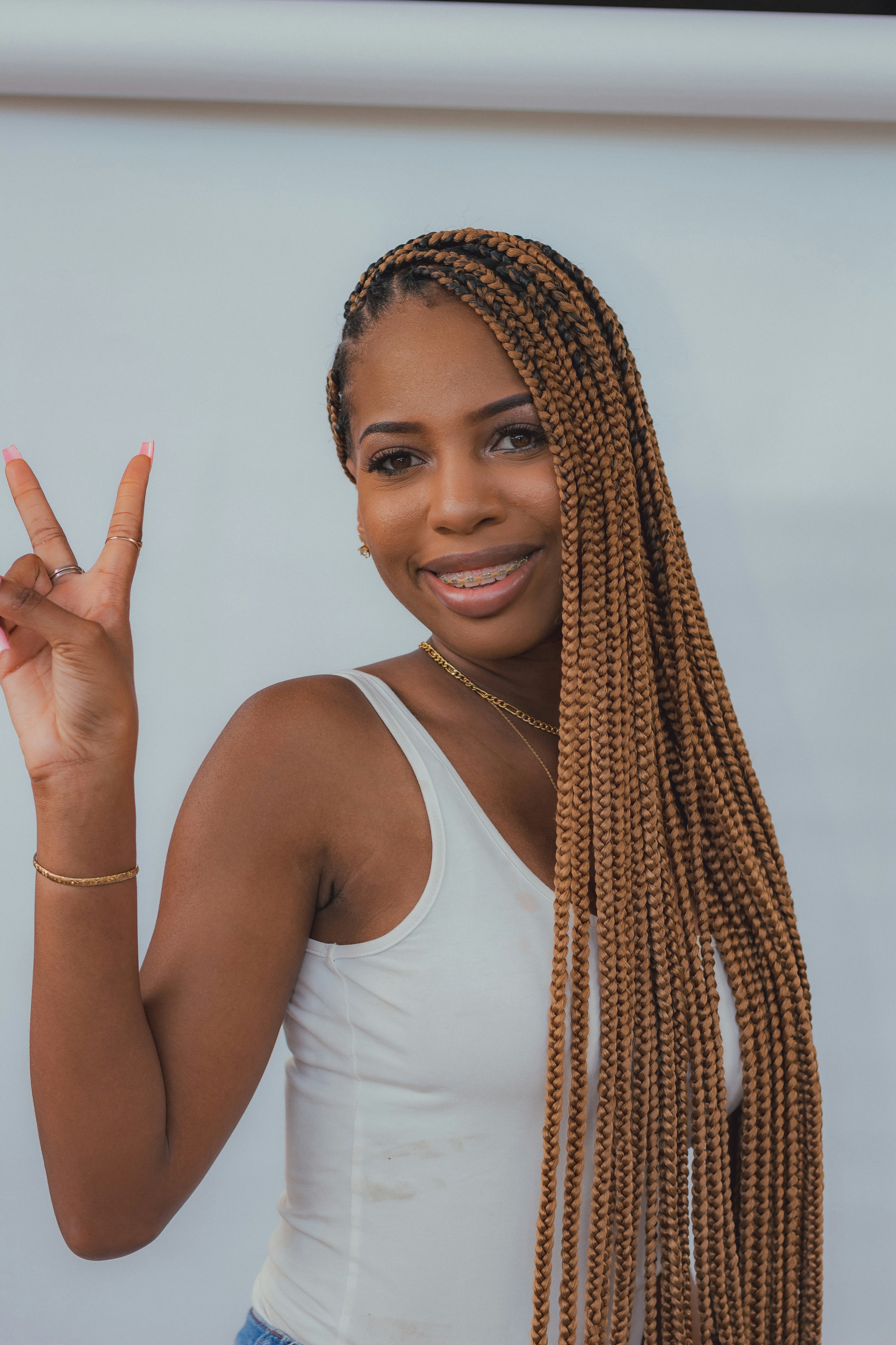 A person smiling and holding up the middle finger photo – Free Portrait ...