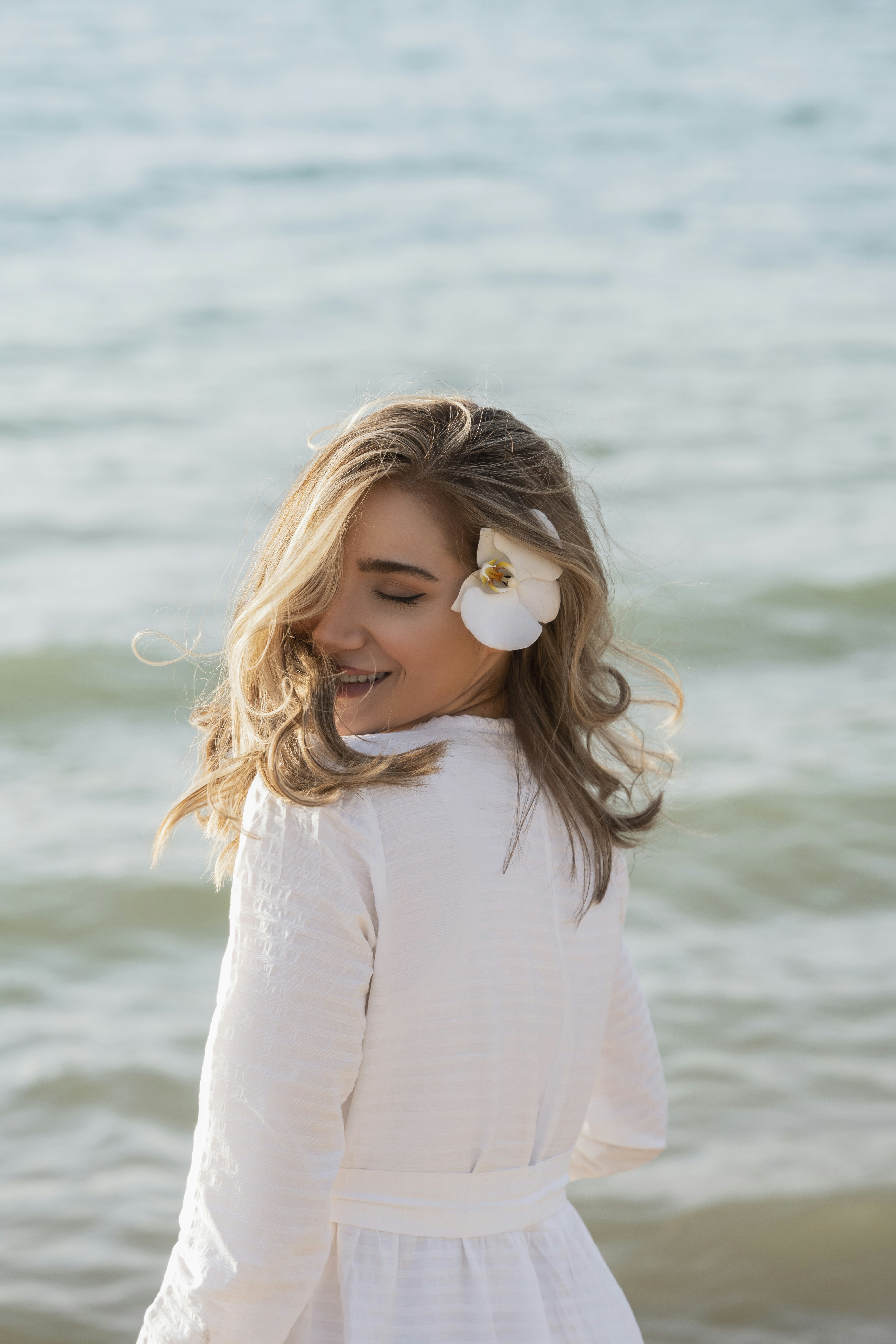 Shoreline Serenade: Portrait with a White Orchid