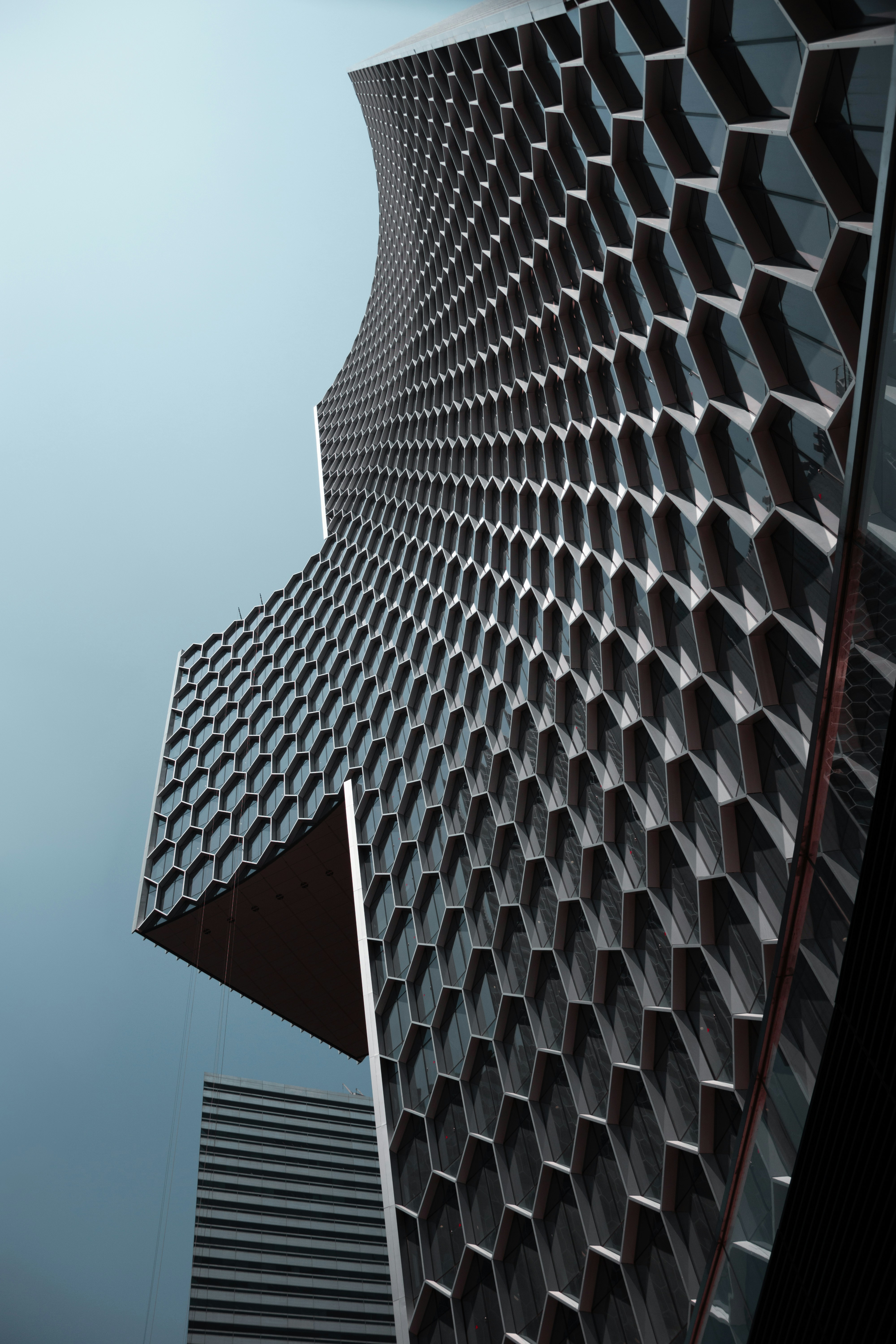 A tall building with a triangular roof photo – Free Singapore Image on ...