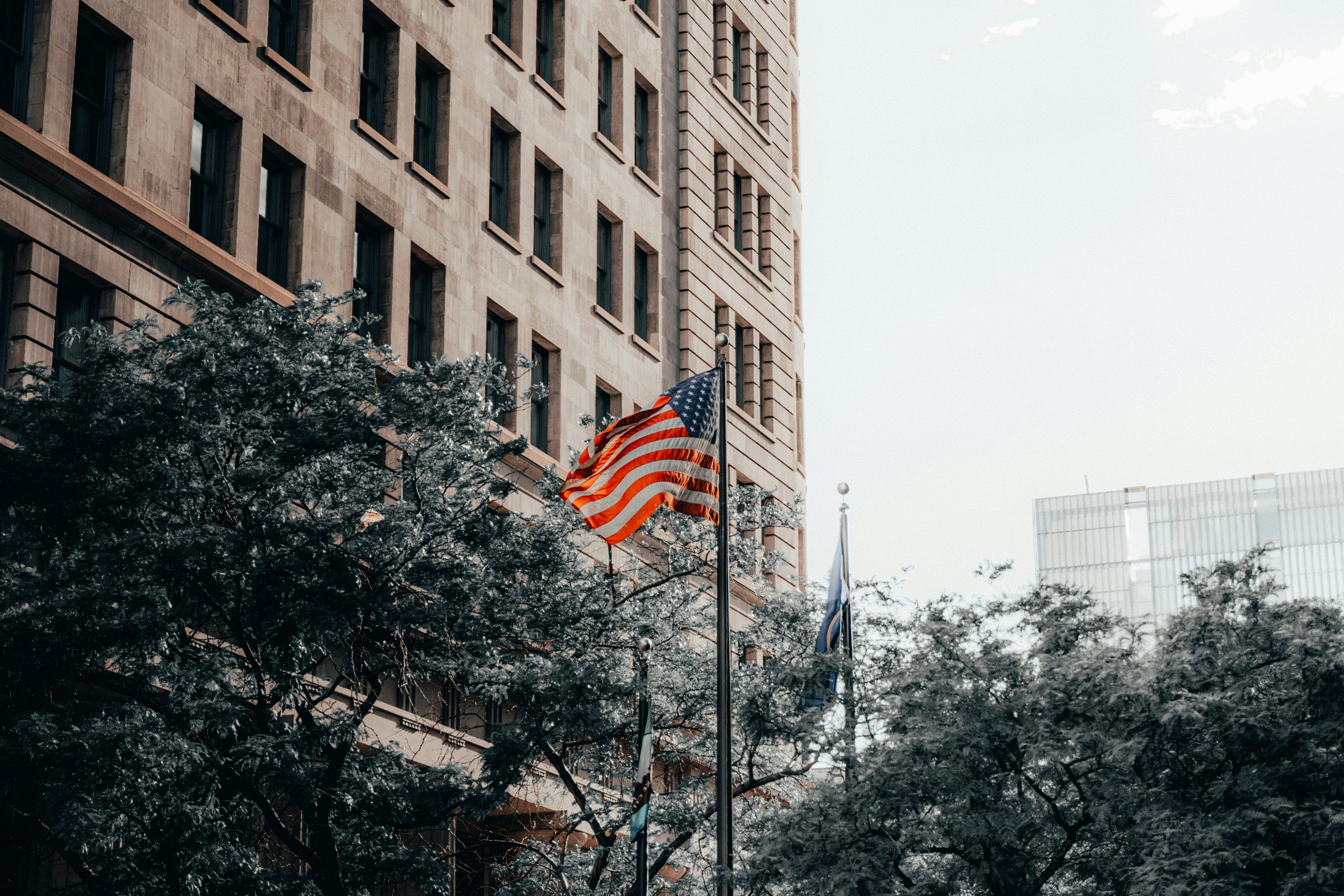 Boston Buildings located in downtown Salt Lake City, UT and the American flag.