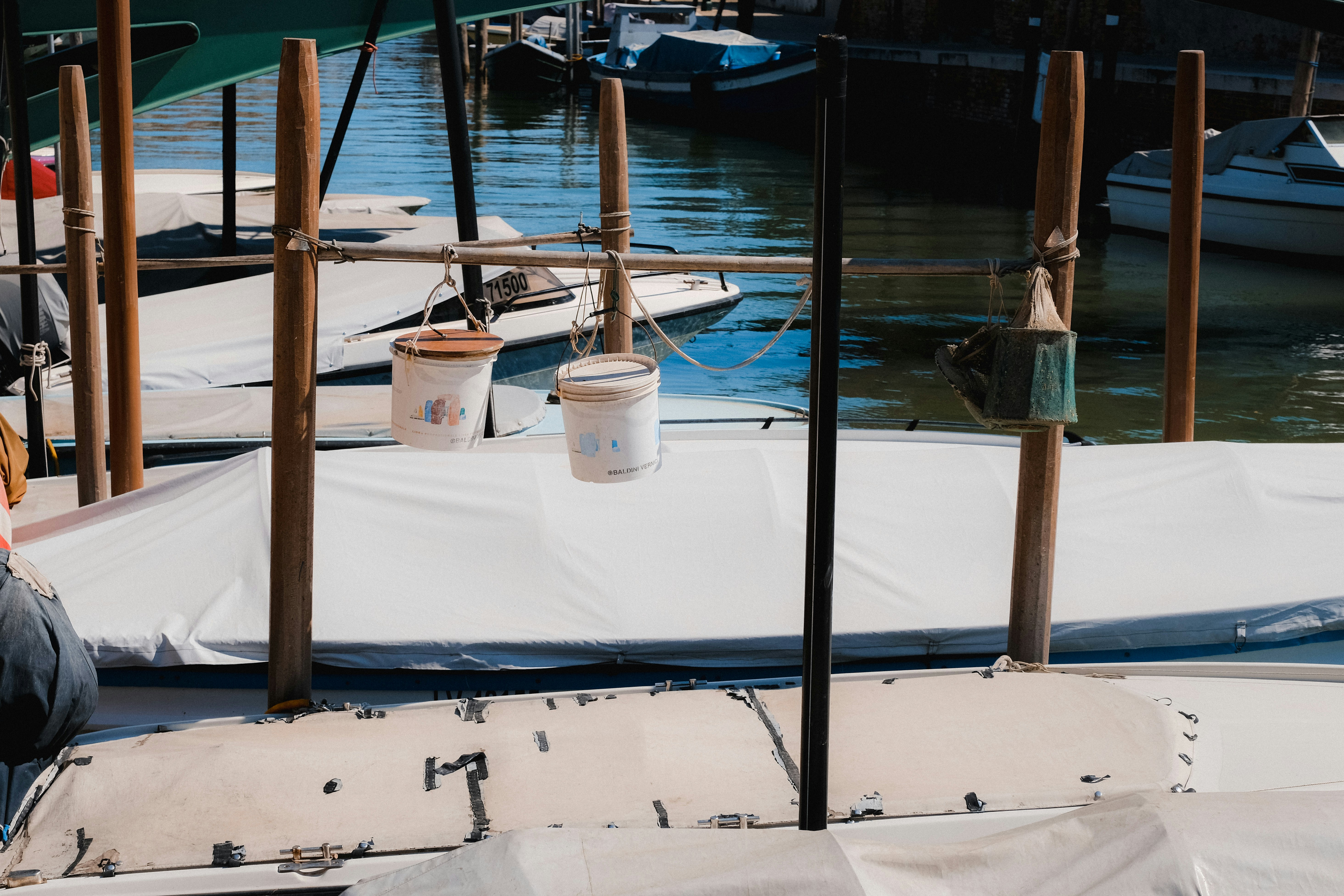 a group of buckets on a dock