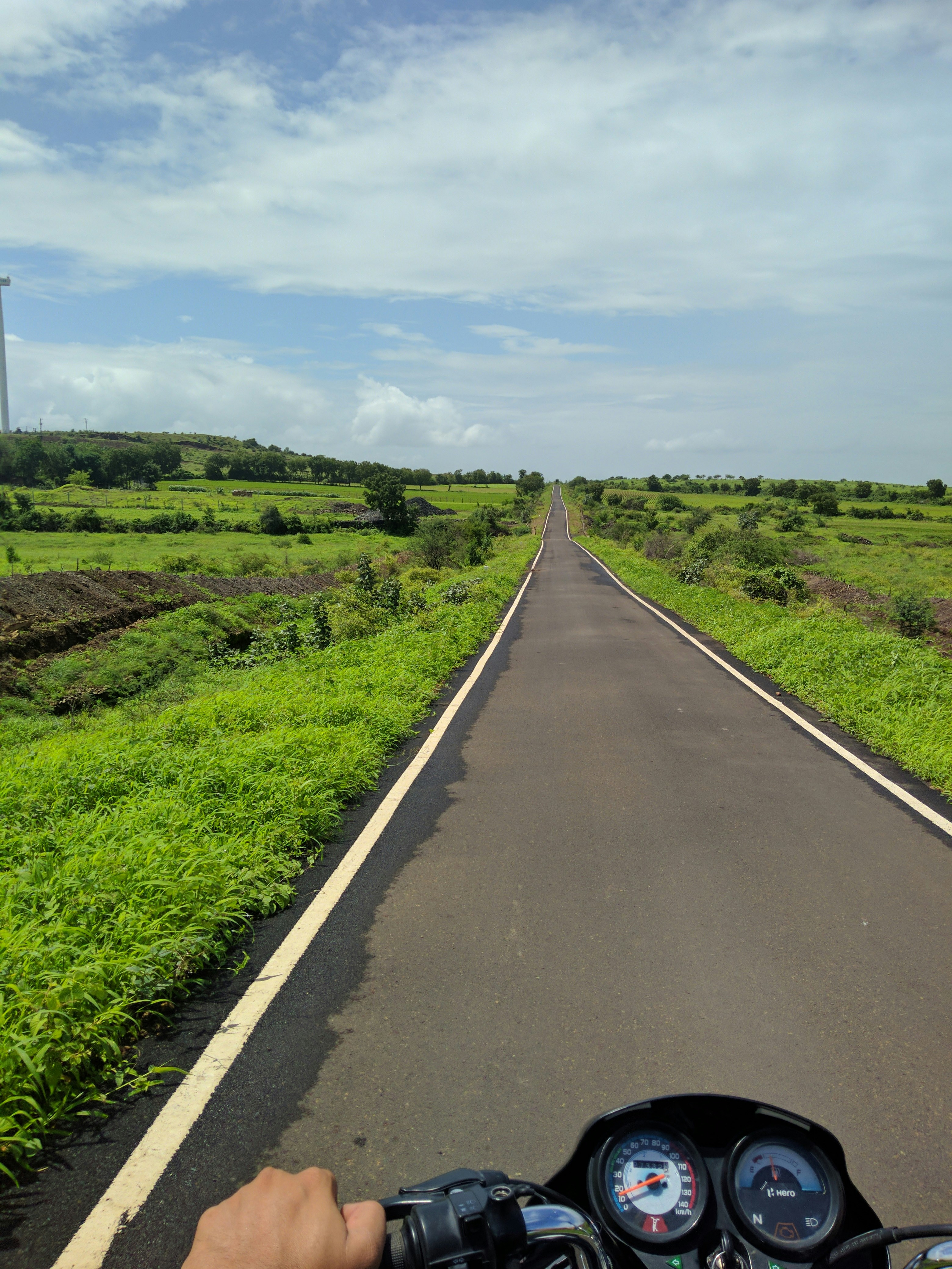 A road with grass on the side photo – Free Human Image on Unsplash