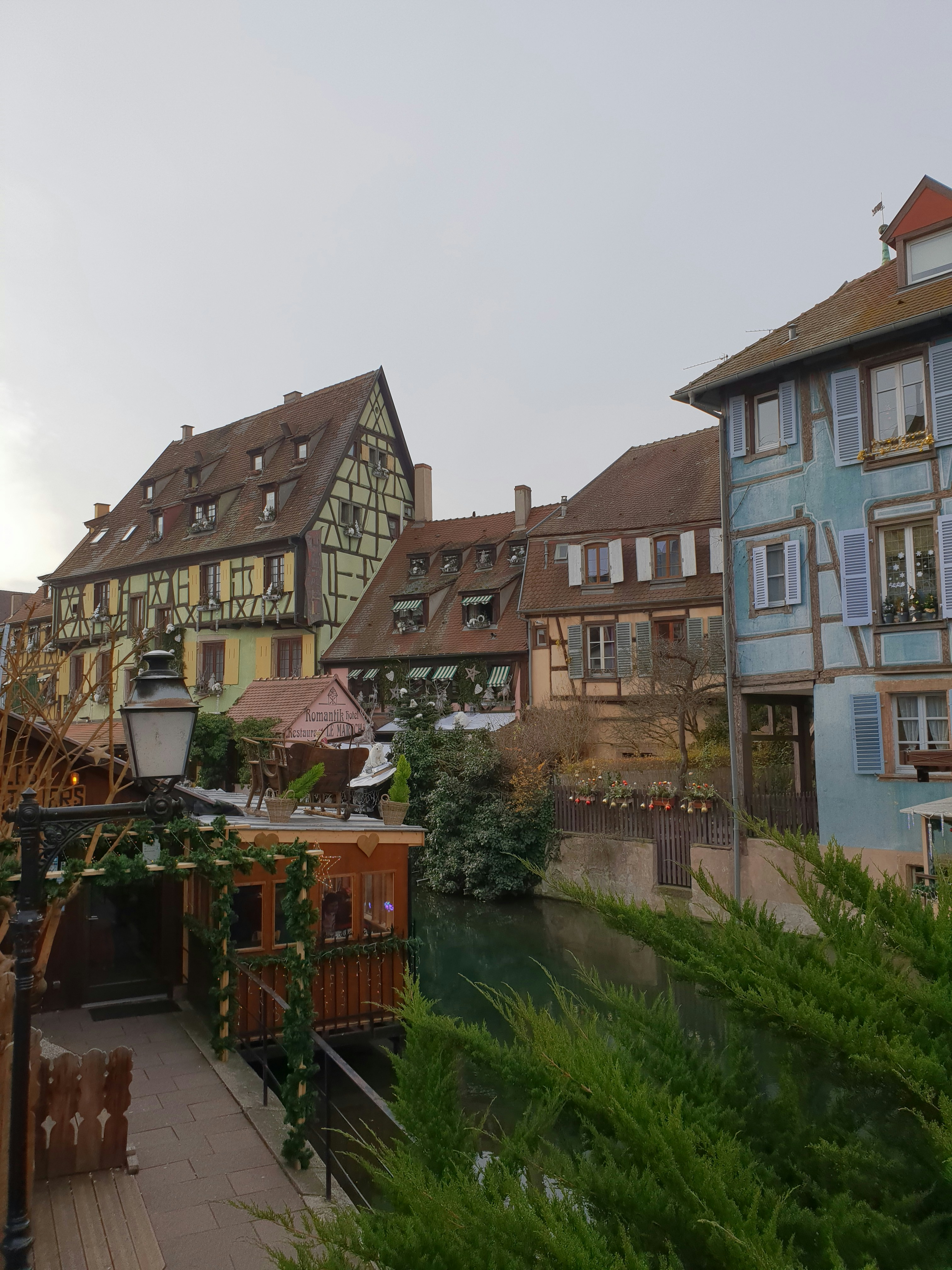 a row of houses next to a river