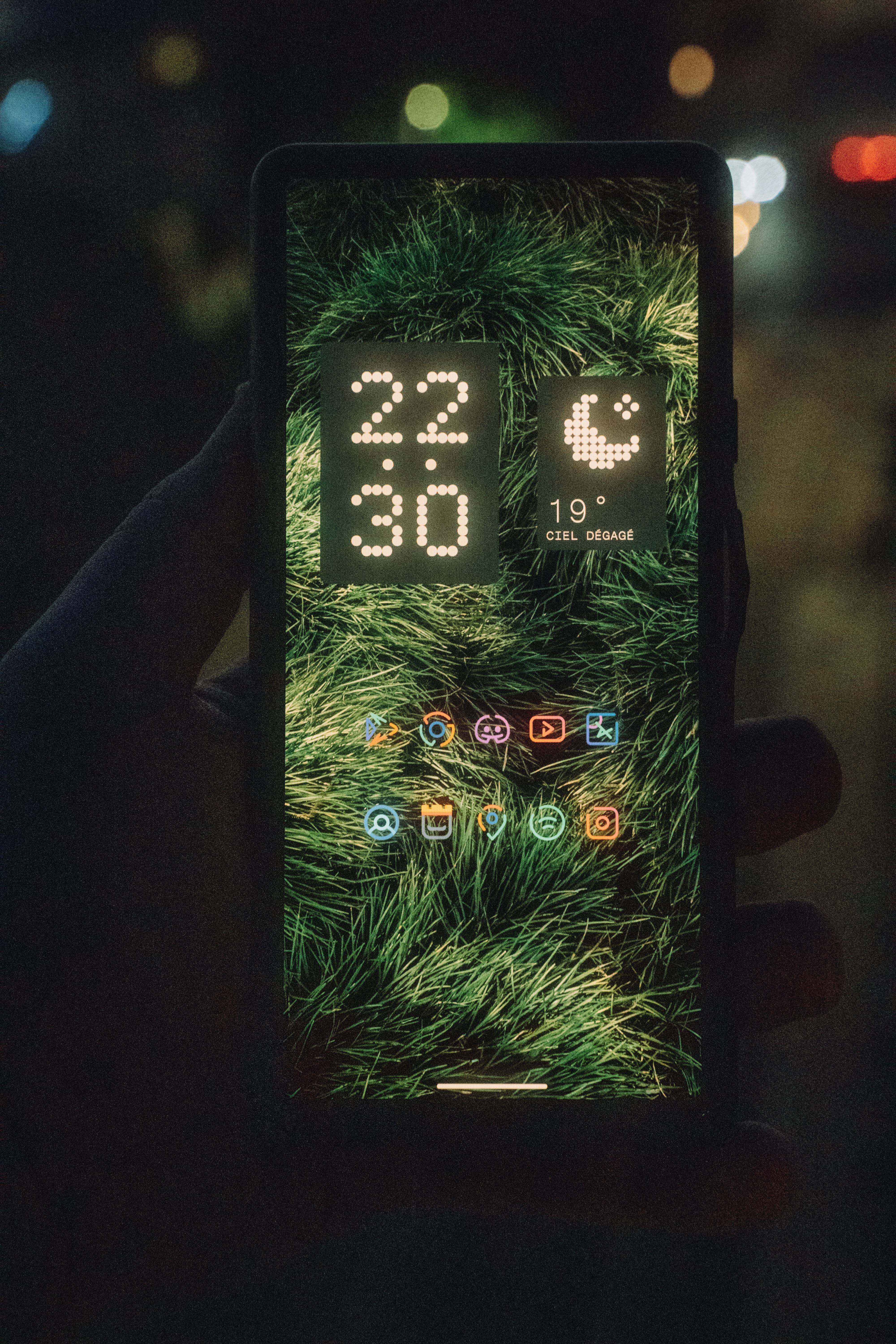 Midnight Pine Glow: Neon Widgets on a Handheld Night Screen