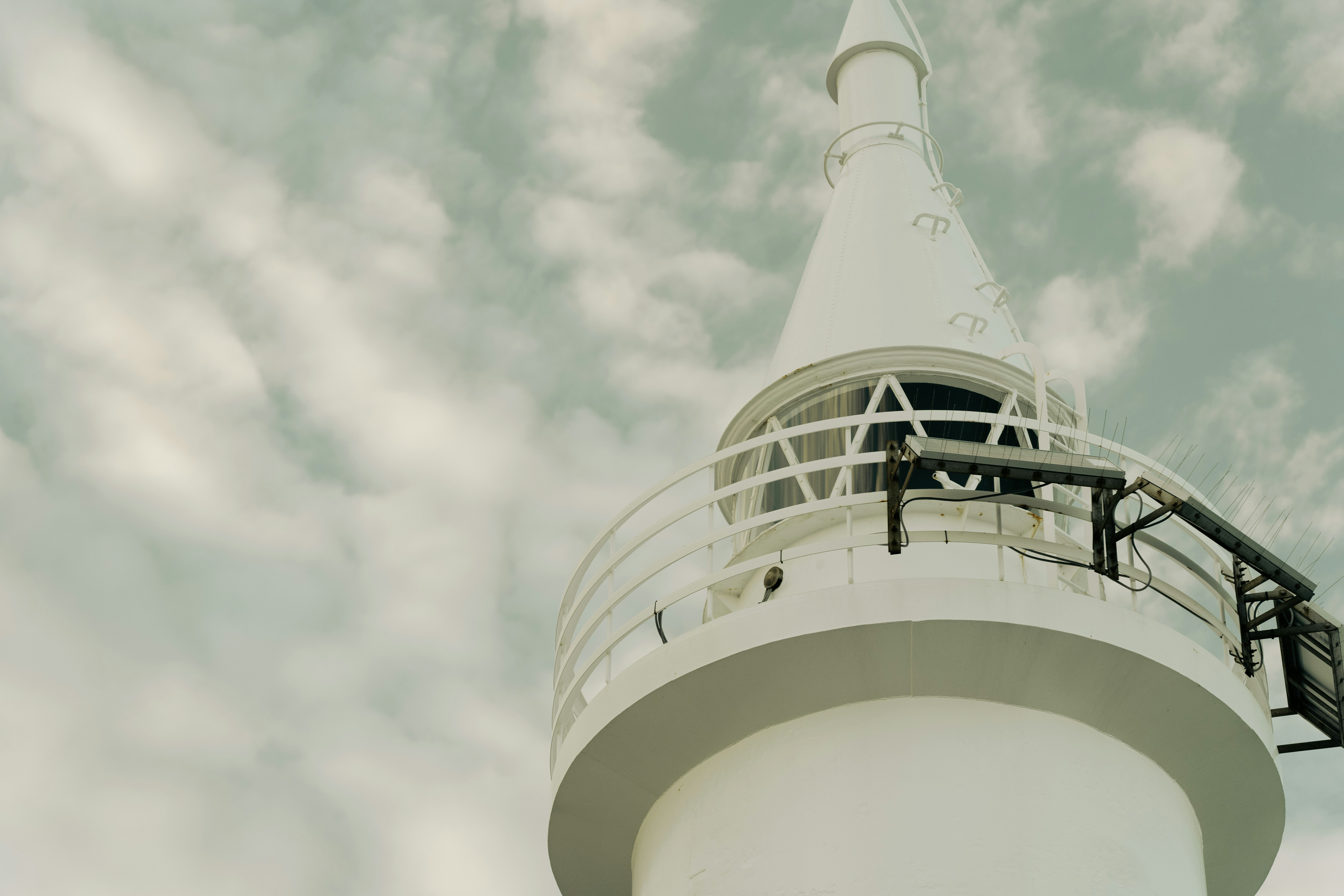 a white tower with a white top