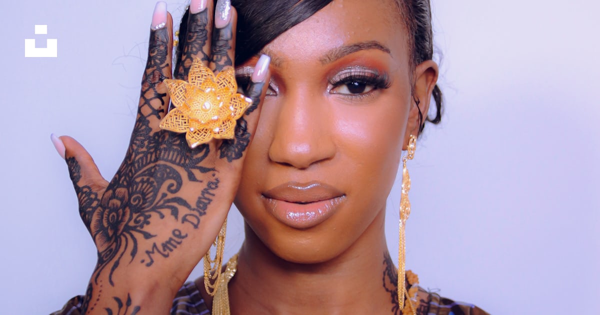 A Woman With A Tattoo On Her Arm Photo Free Face Image On Unsplash