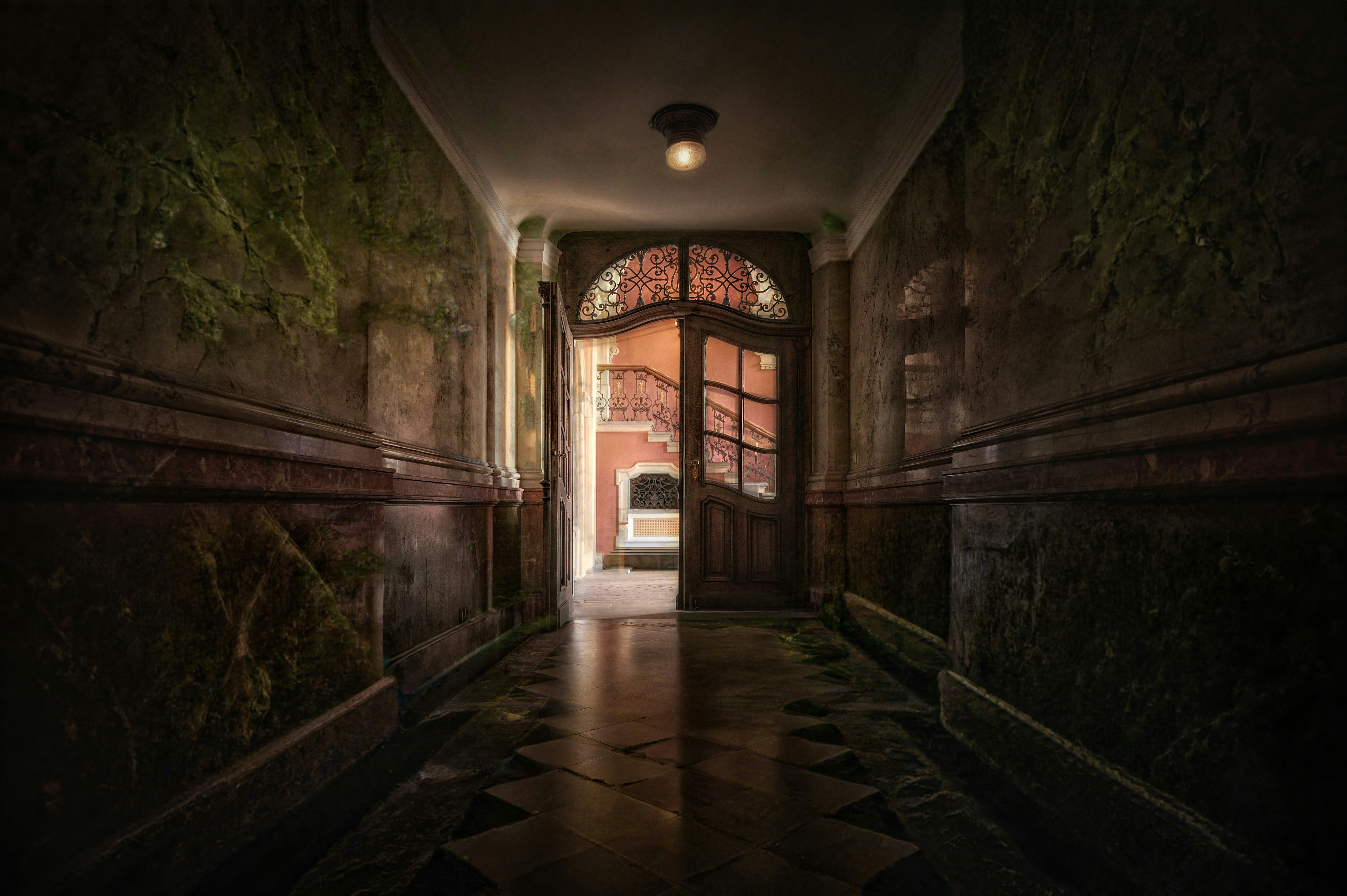 A dark stone hallway with a stone walkway photo – Free Corridor Image ...
