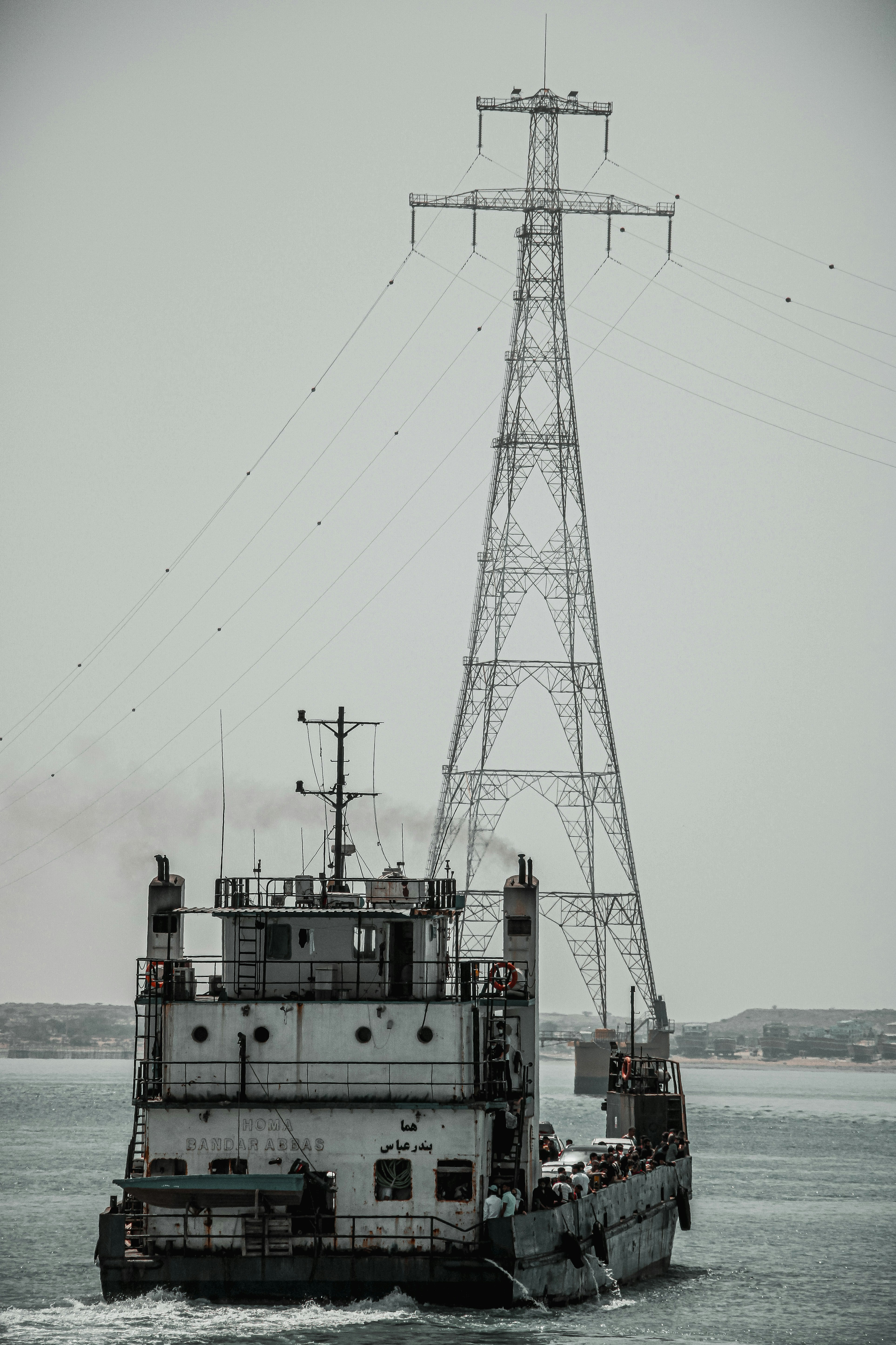 Tugboat in the Shadow of a Lattice Tower