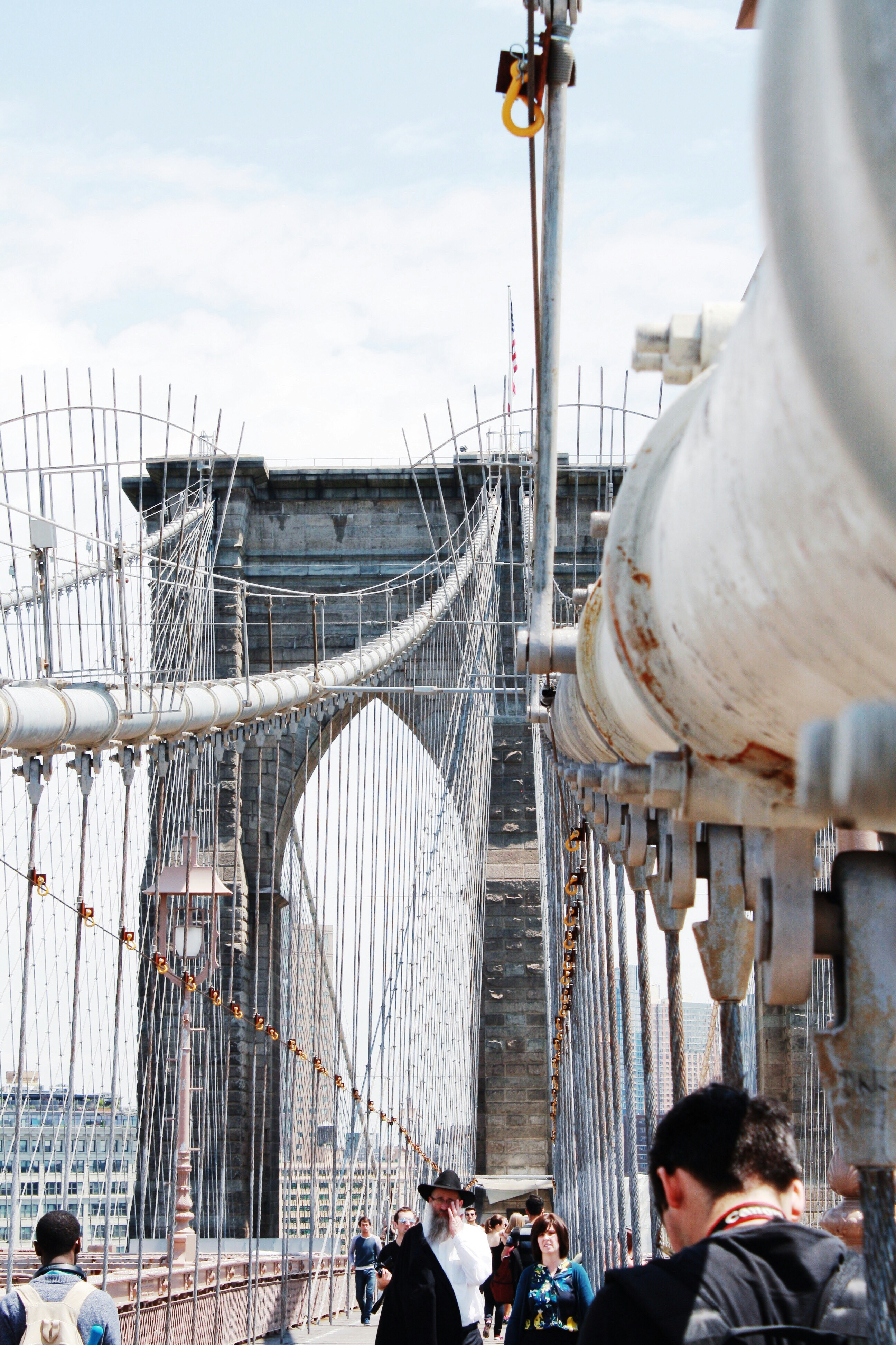A group of people walking on a bridge photo – Free New york Image on ...