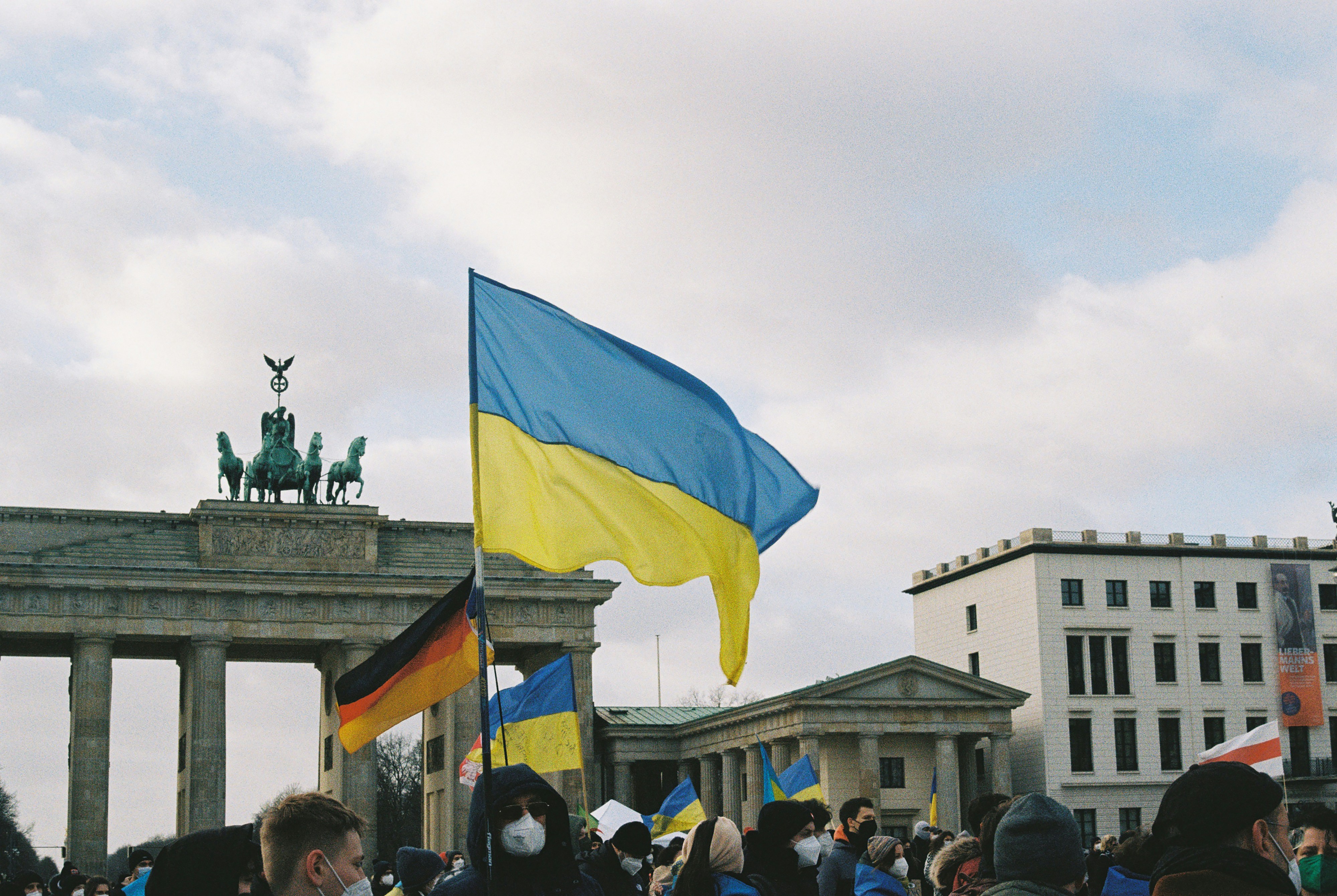 a group of people holding flags