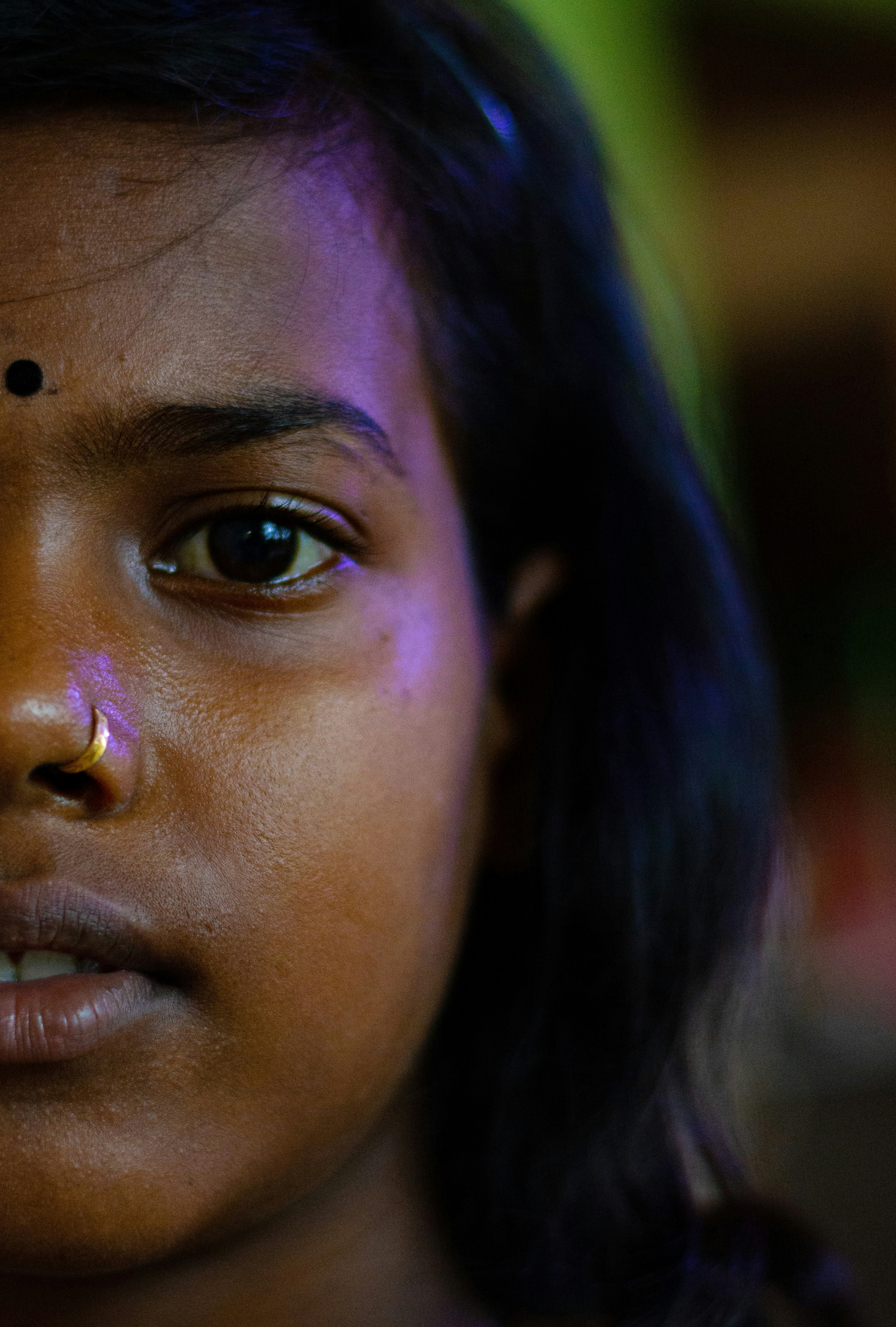 Indigo Gaze: A Half-Face Portrait in Neon Light