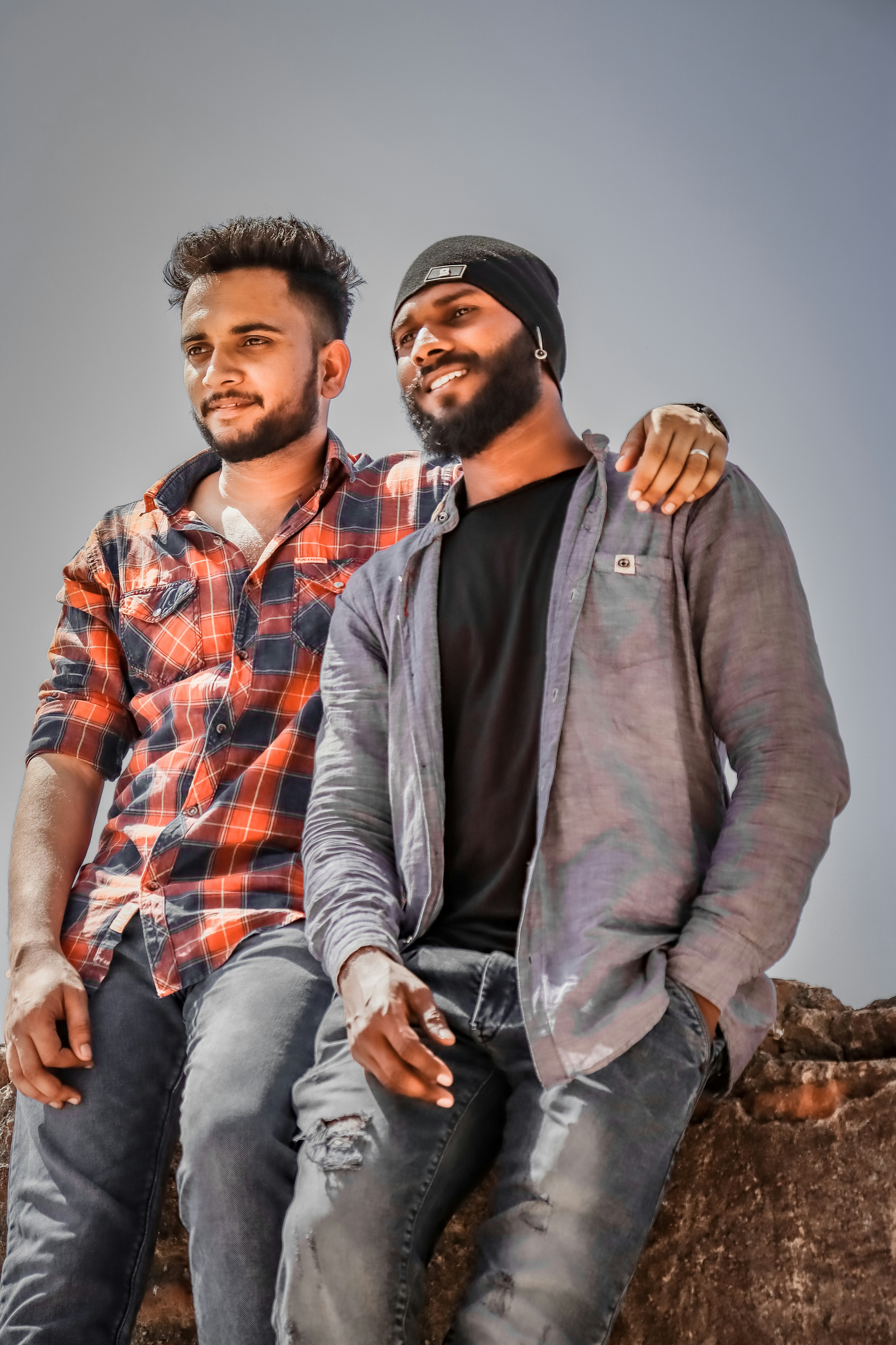 Rocky Ledge Portrait: Casual camaraderie under studio glow