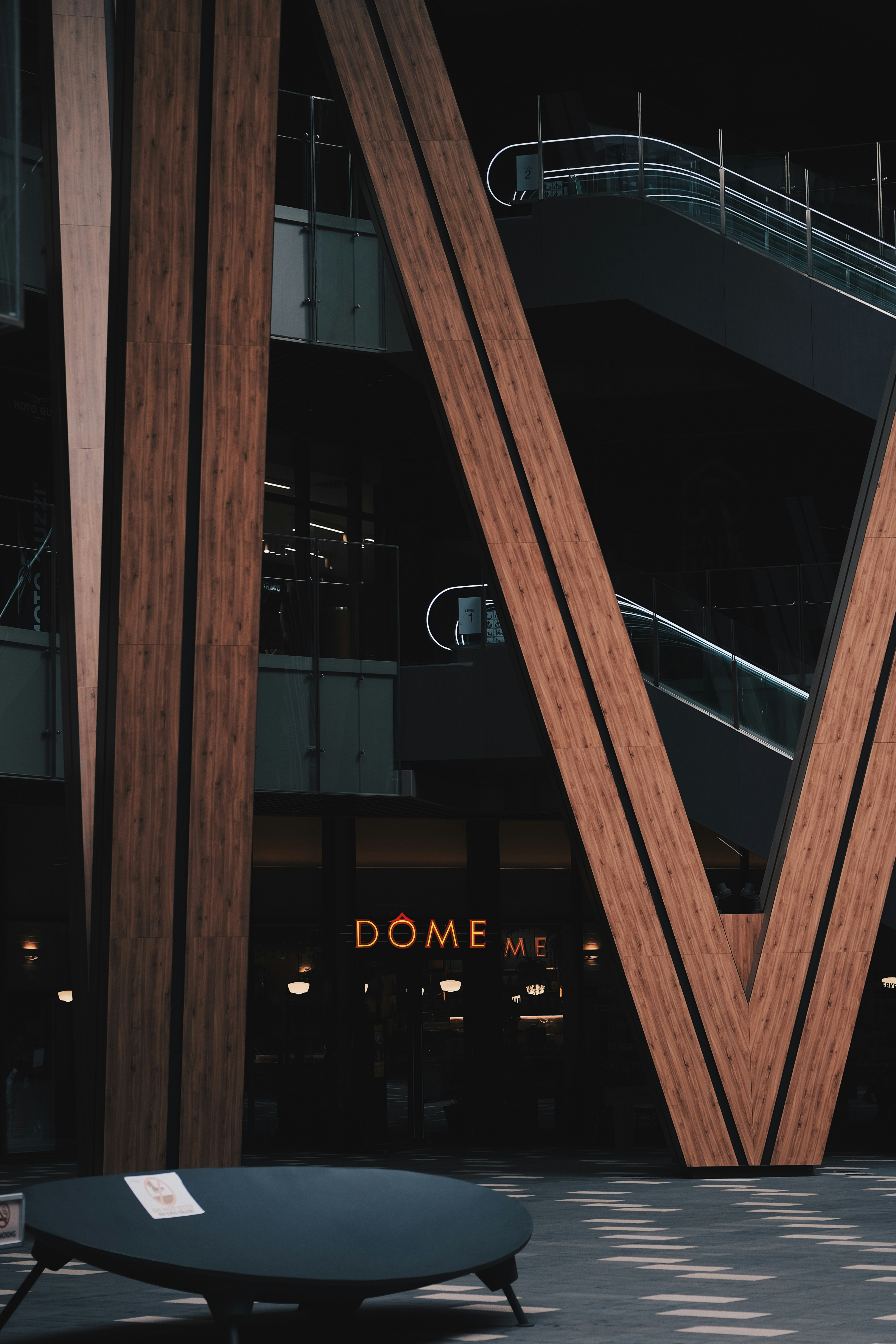 V-Frame Night: Timber Arches Framing the Dome Entrance