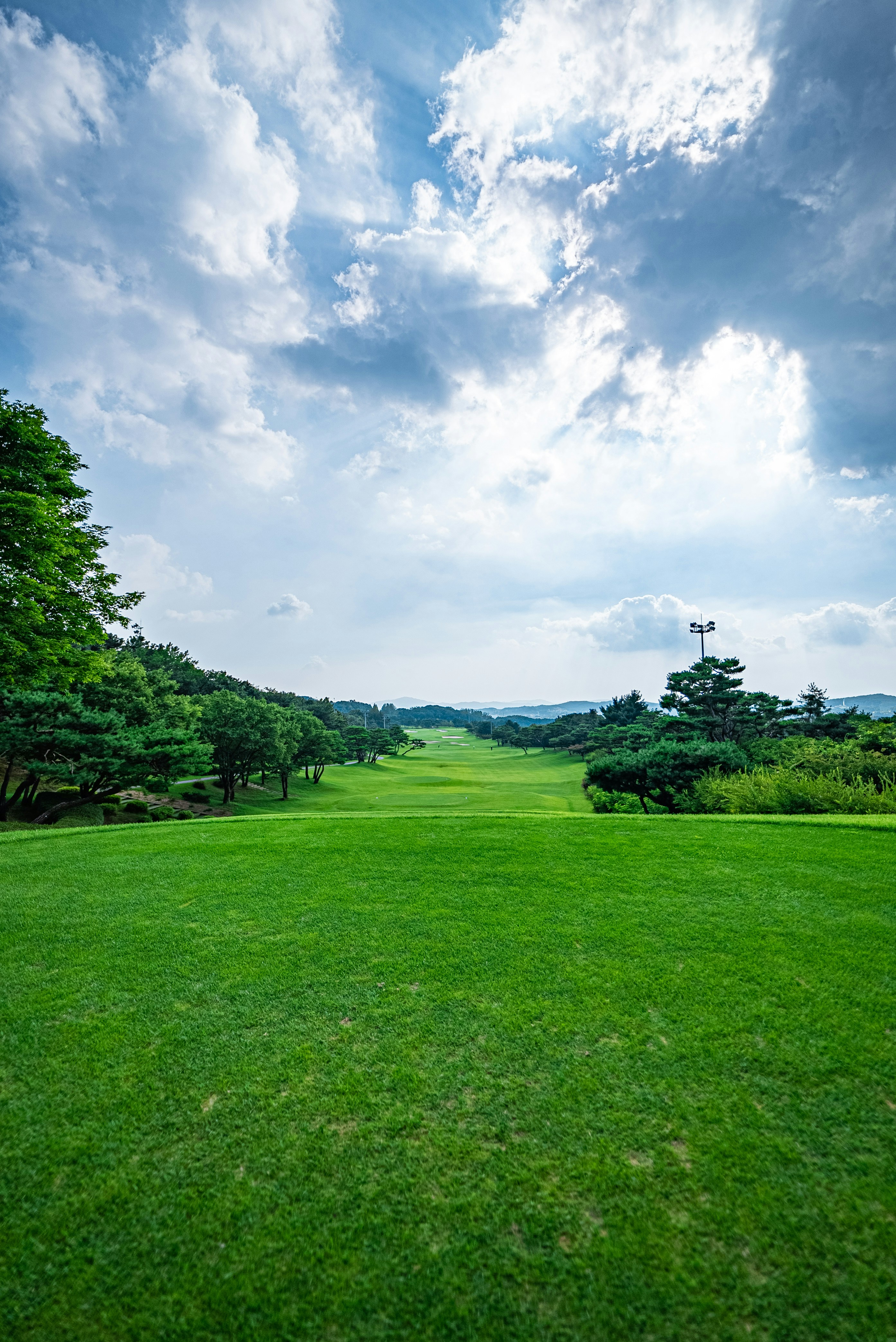 Emerald Fairway Under a Dynamic Sky