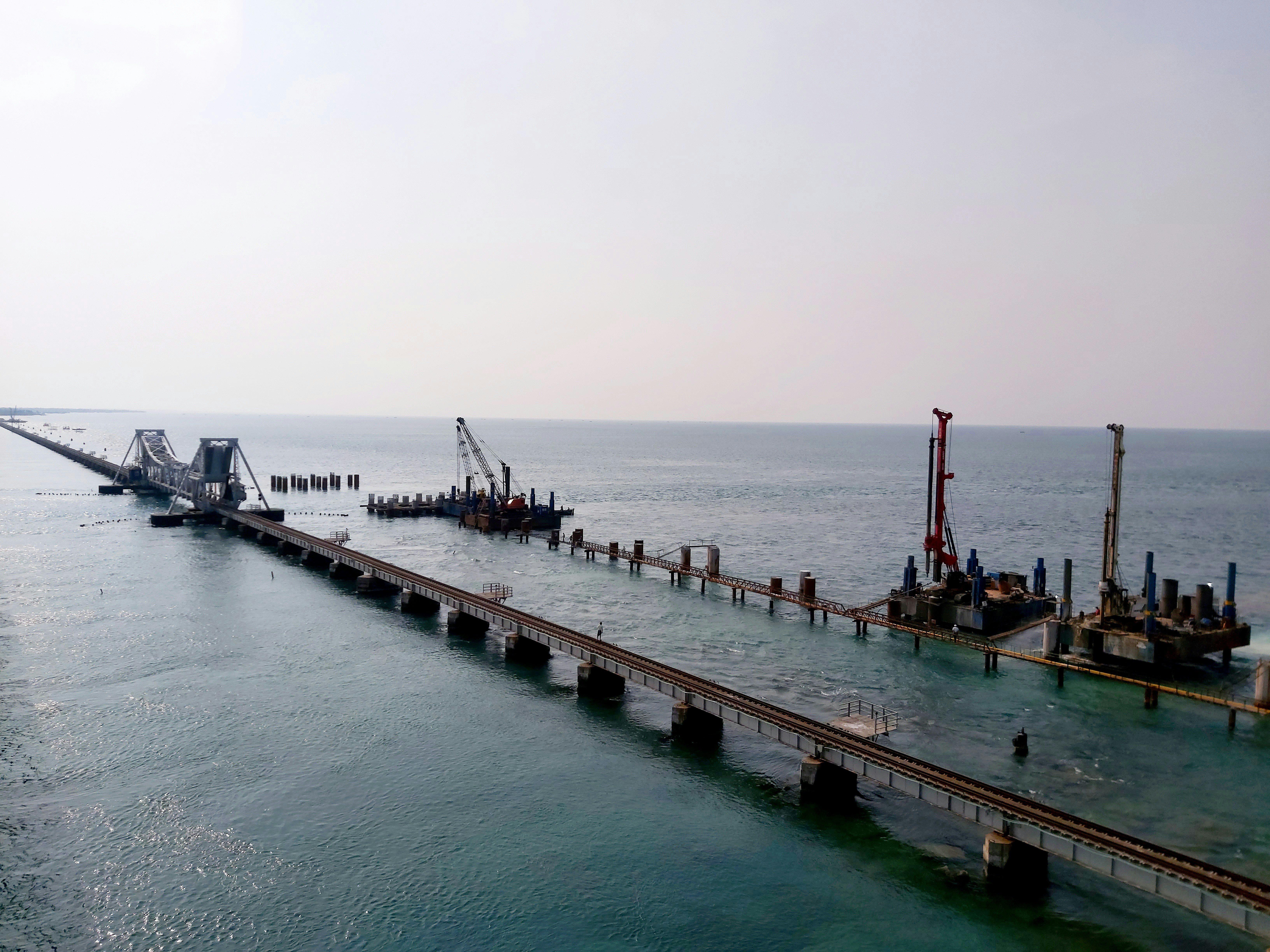 A long dock with a boat on it photo – Free Grey Image on Unsplash