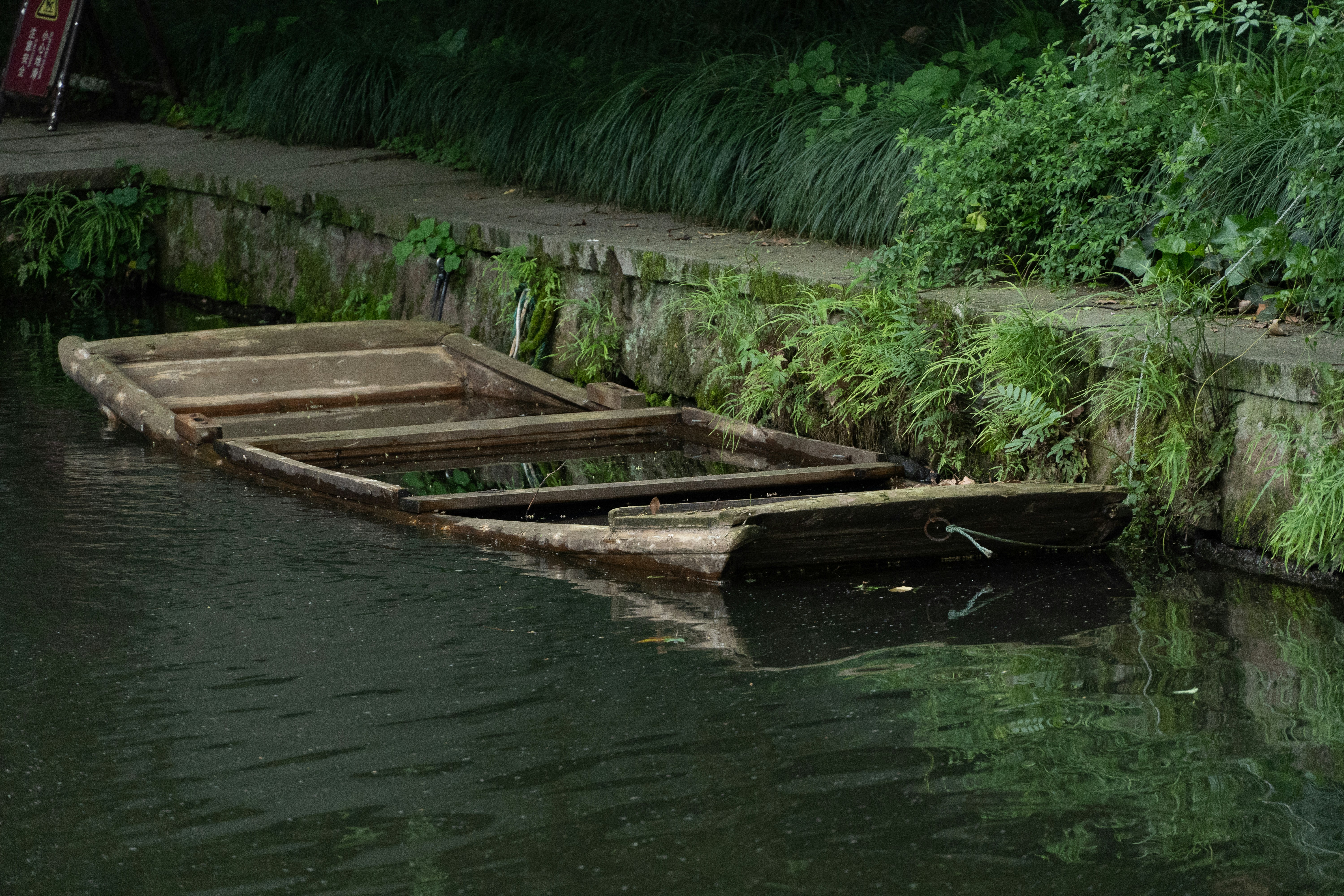a group of boats sit in a body of water