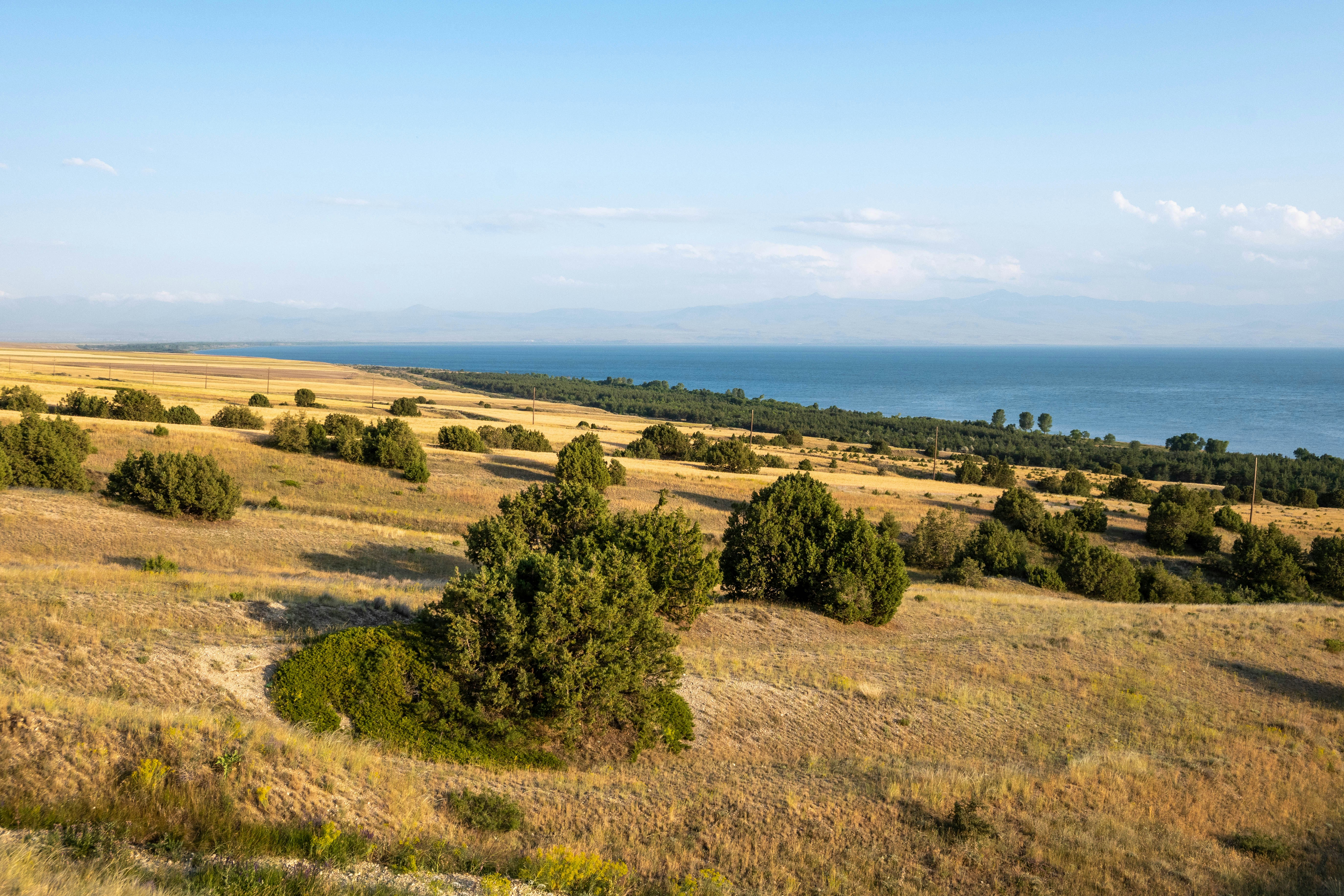 Evening light floods the fields adjacent to the northern shores of Lake Sevan.