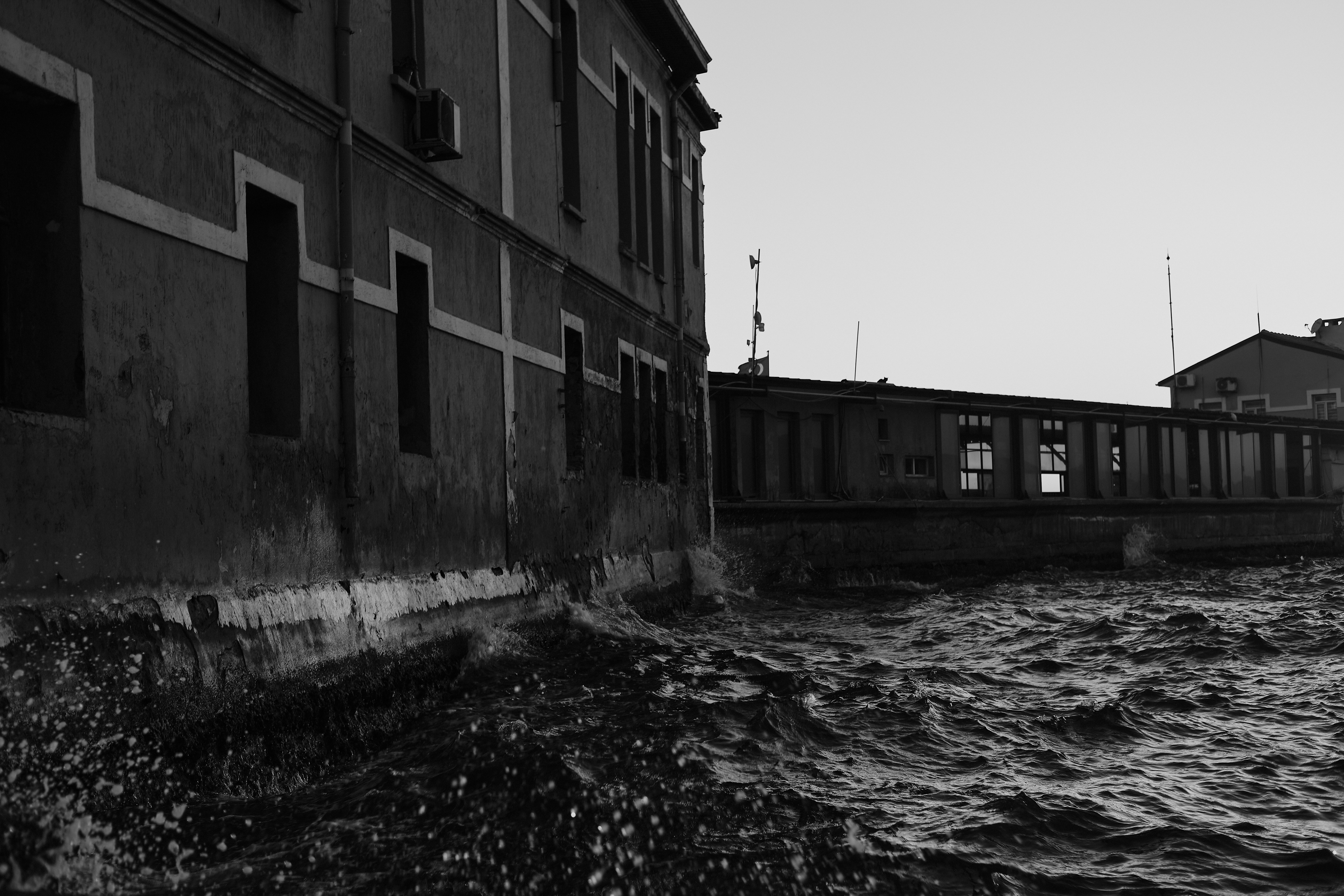 a building next to a body of water