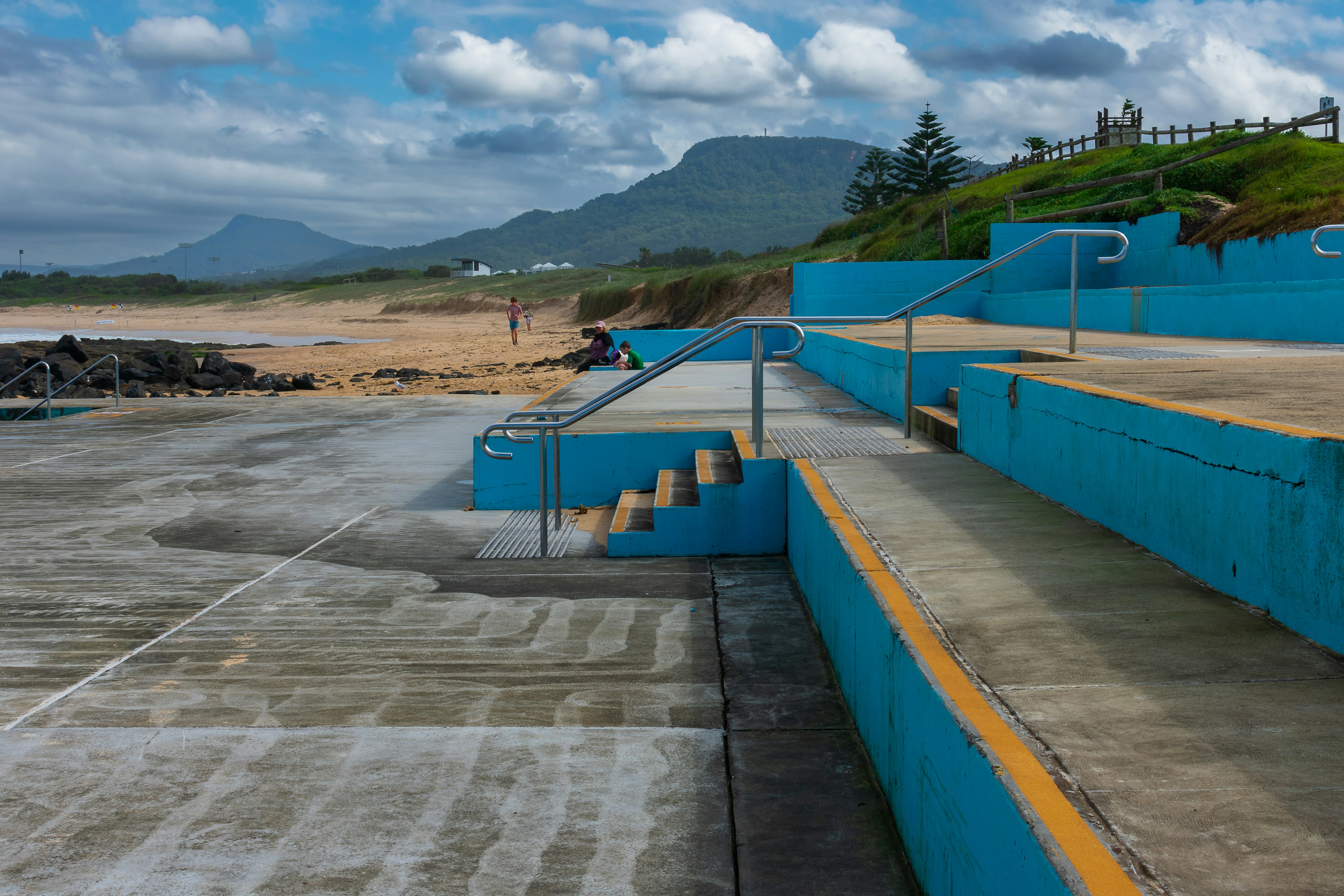 Seaside pool steps | a large blue water dam