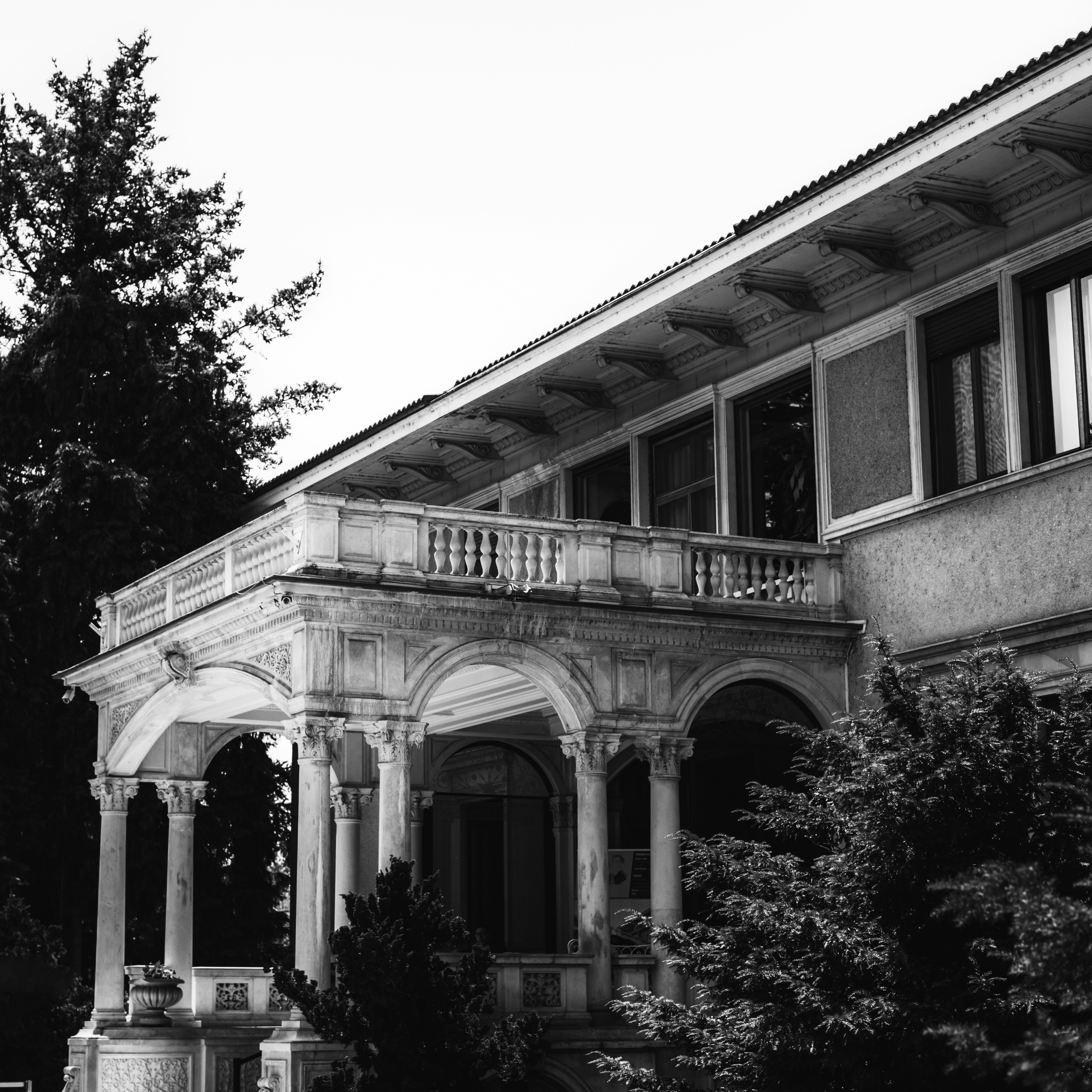 A building with columns and a balcony photo – Free Bucharest Image on ...