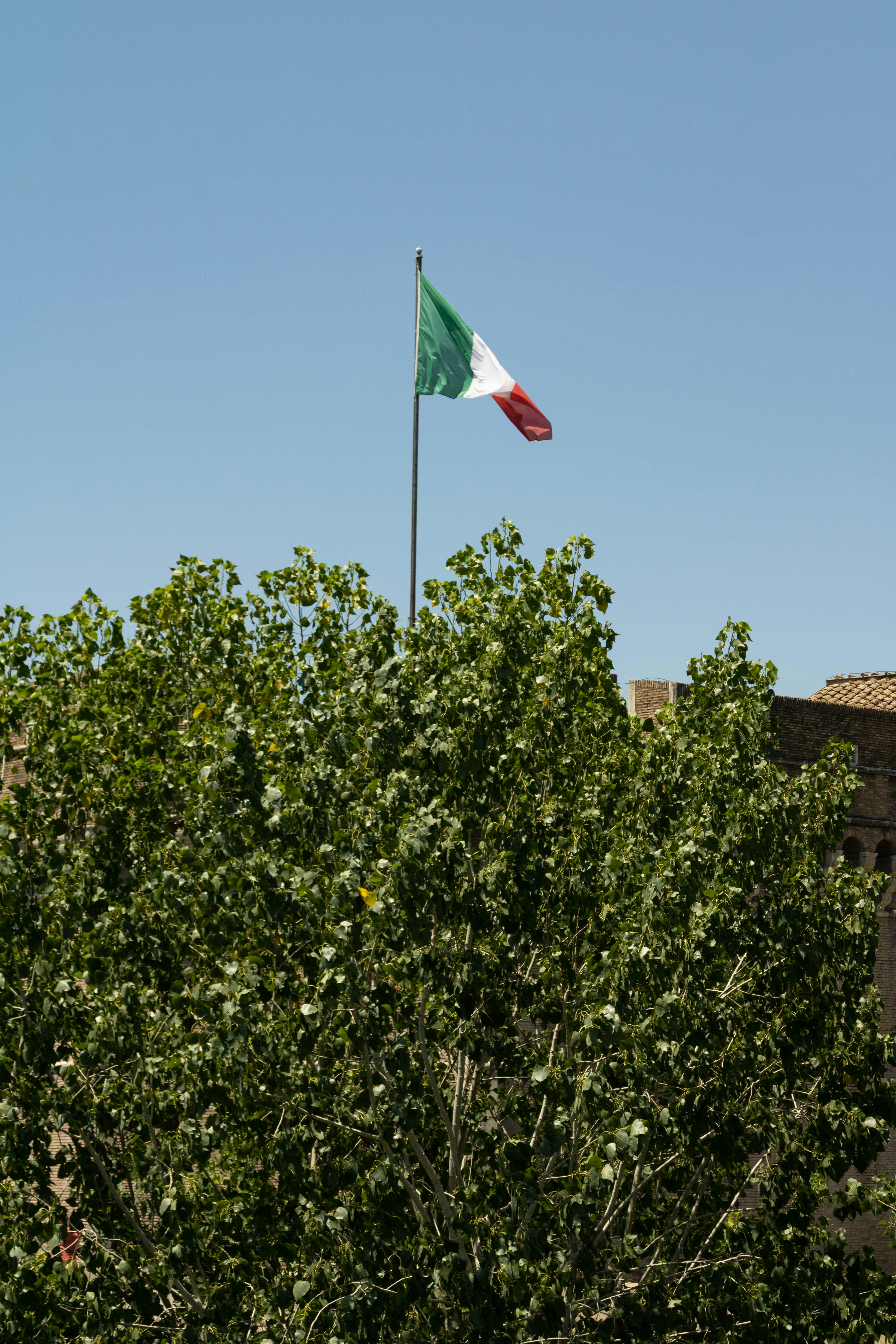 Flag of Italy against a blue sky