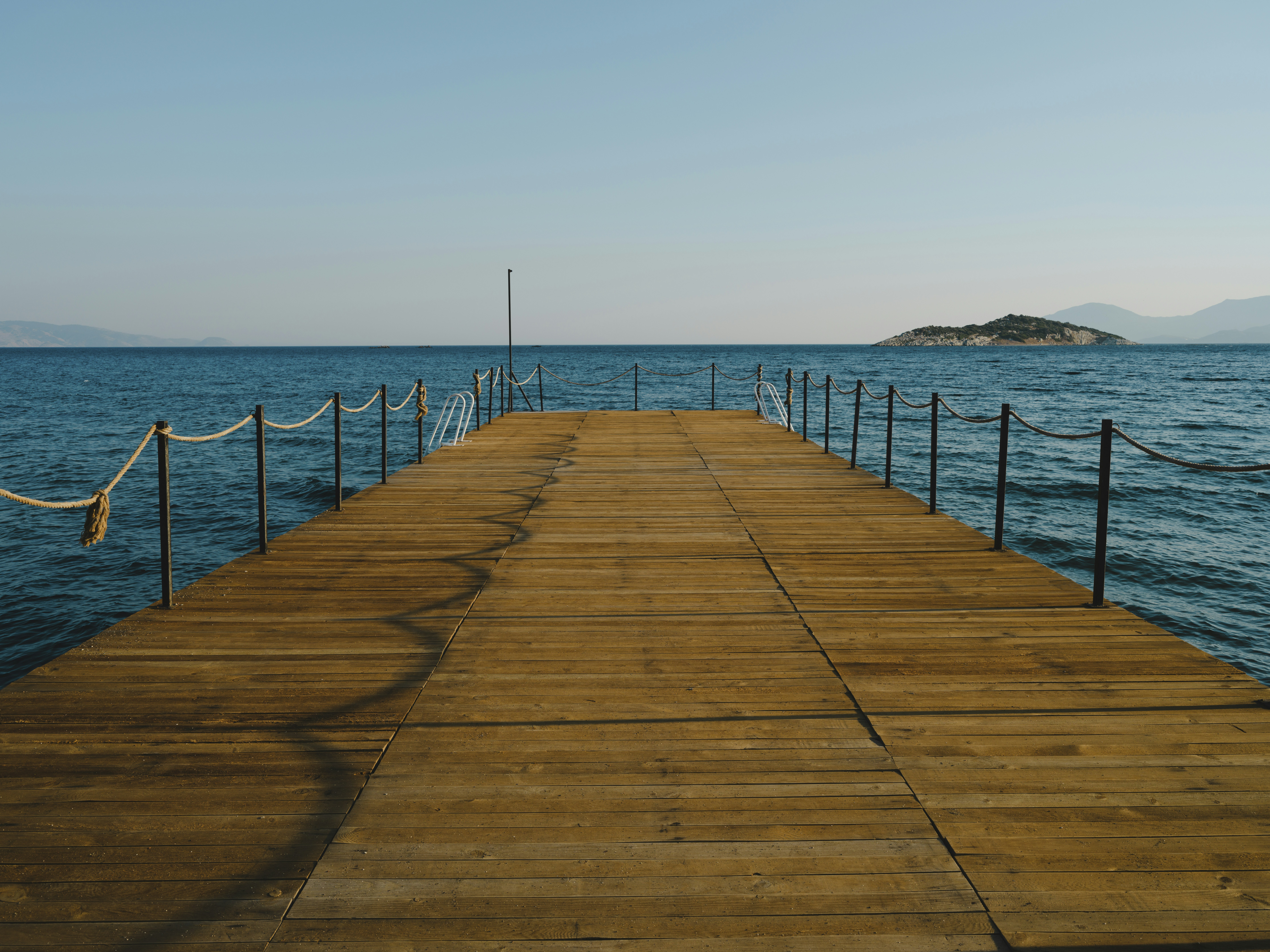A wooden dock over water photo – Free Water Image on Unsplash