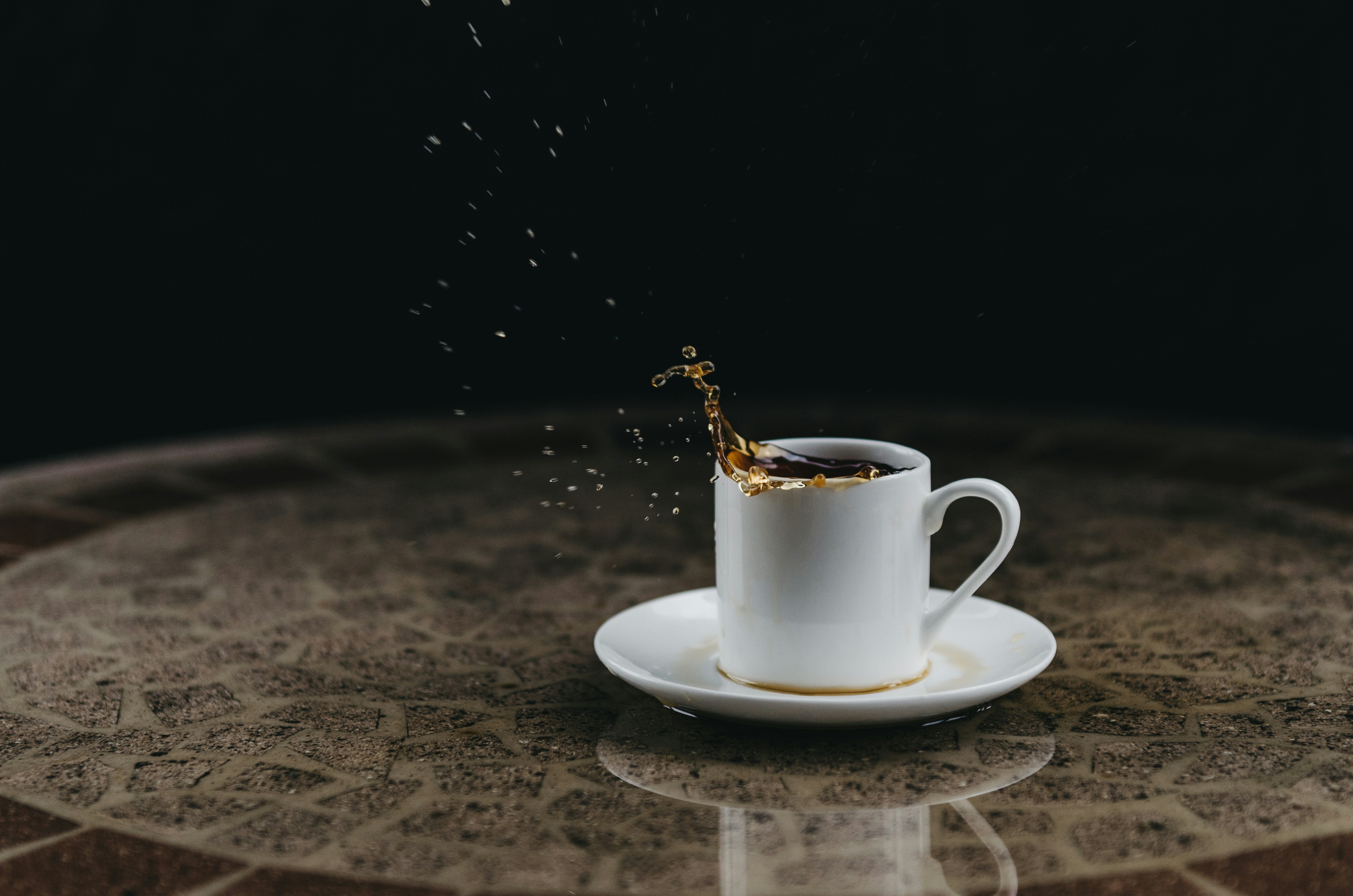 A cup of coffee with a bug on top of it photo – Free Cup Image on Unsplash
