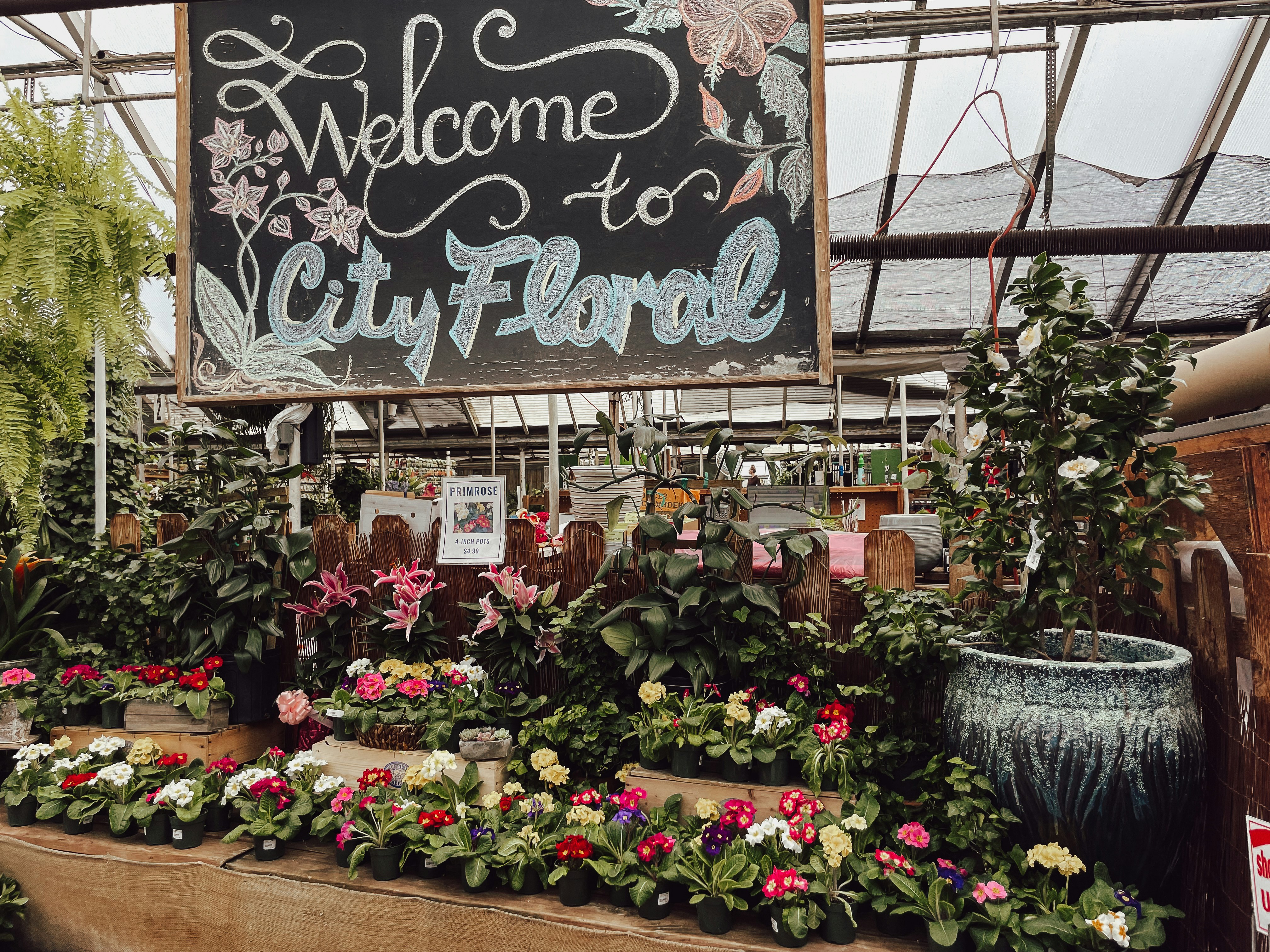Chalkboard Welcome Over City Florade's Blooming Stand