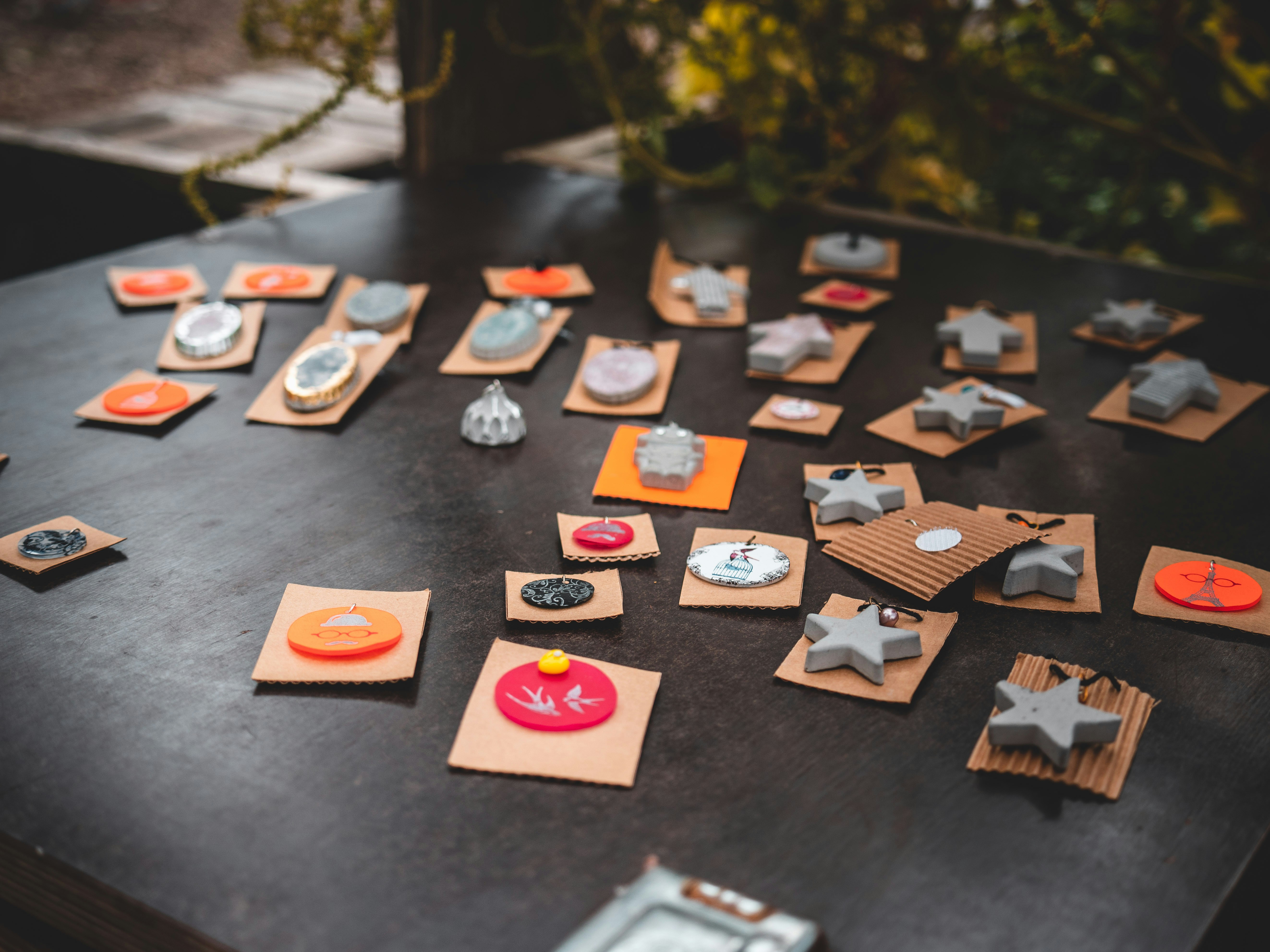 Tiny Emblems on Leather Tiles: A Quiet Parade of Mini Pins