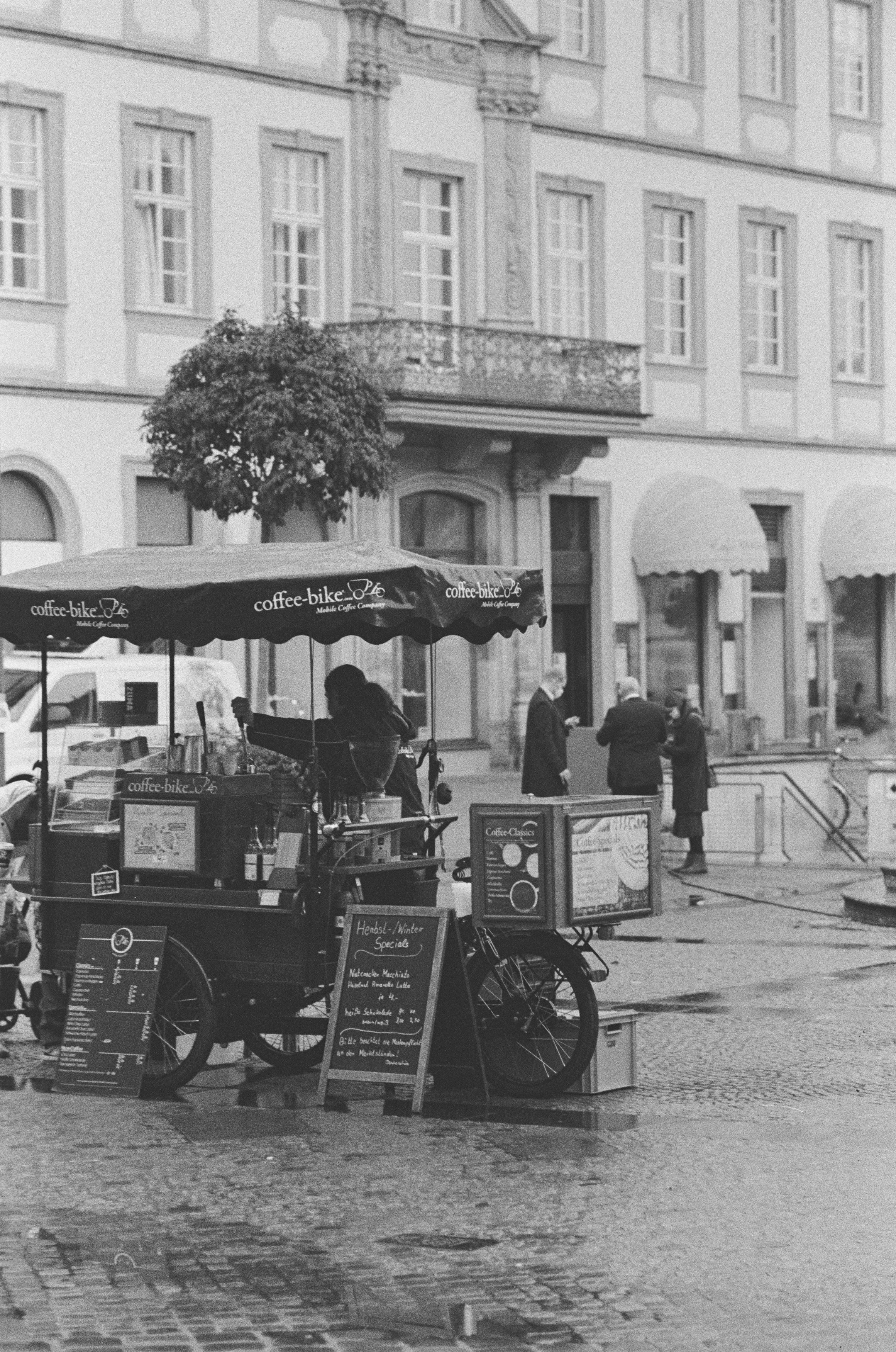 A group of people standing outside a building photo – Free Grey Image ...