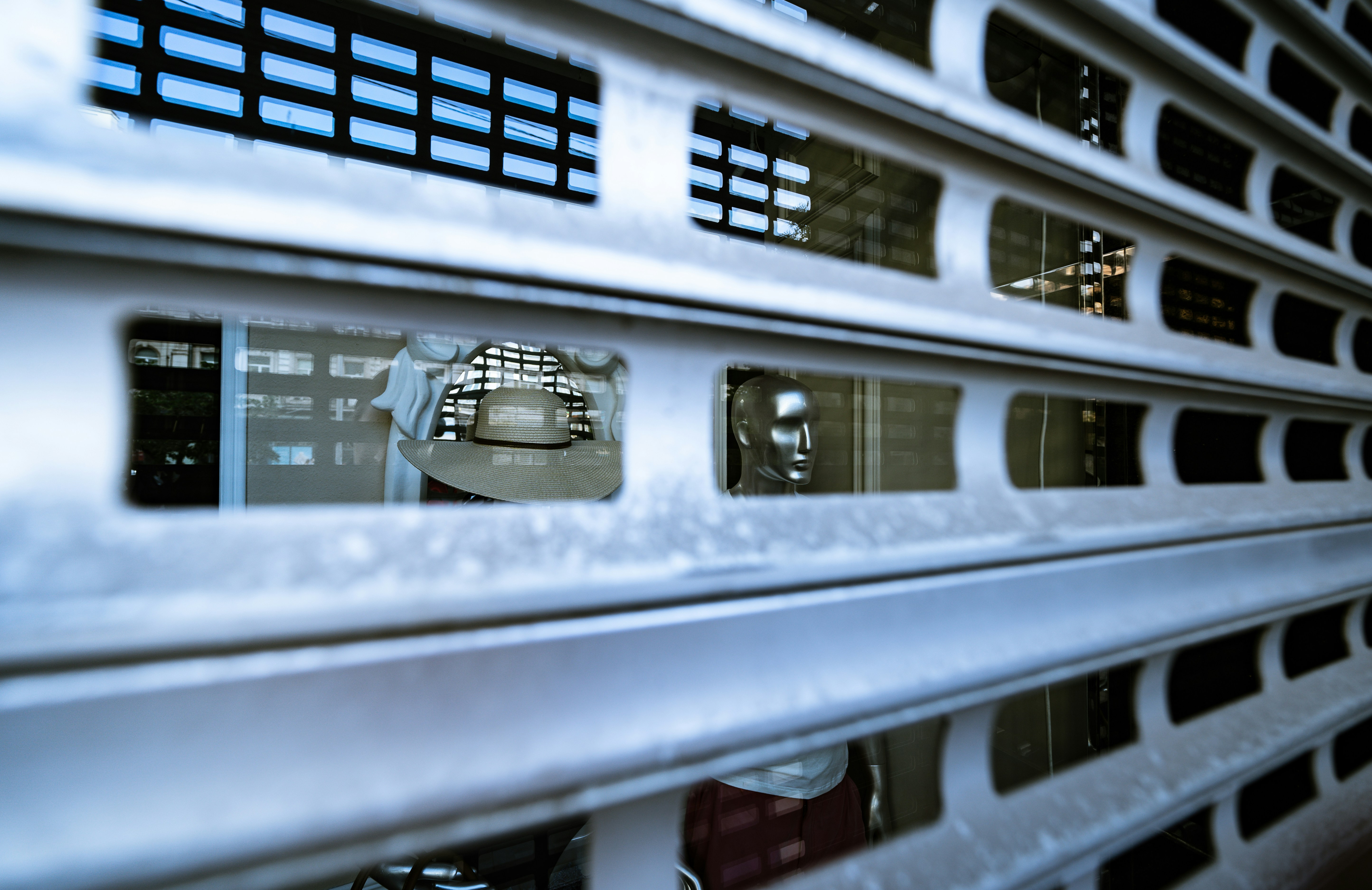 Masked Railway Grilles: A Glint of Faces Behind the Slats