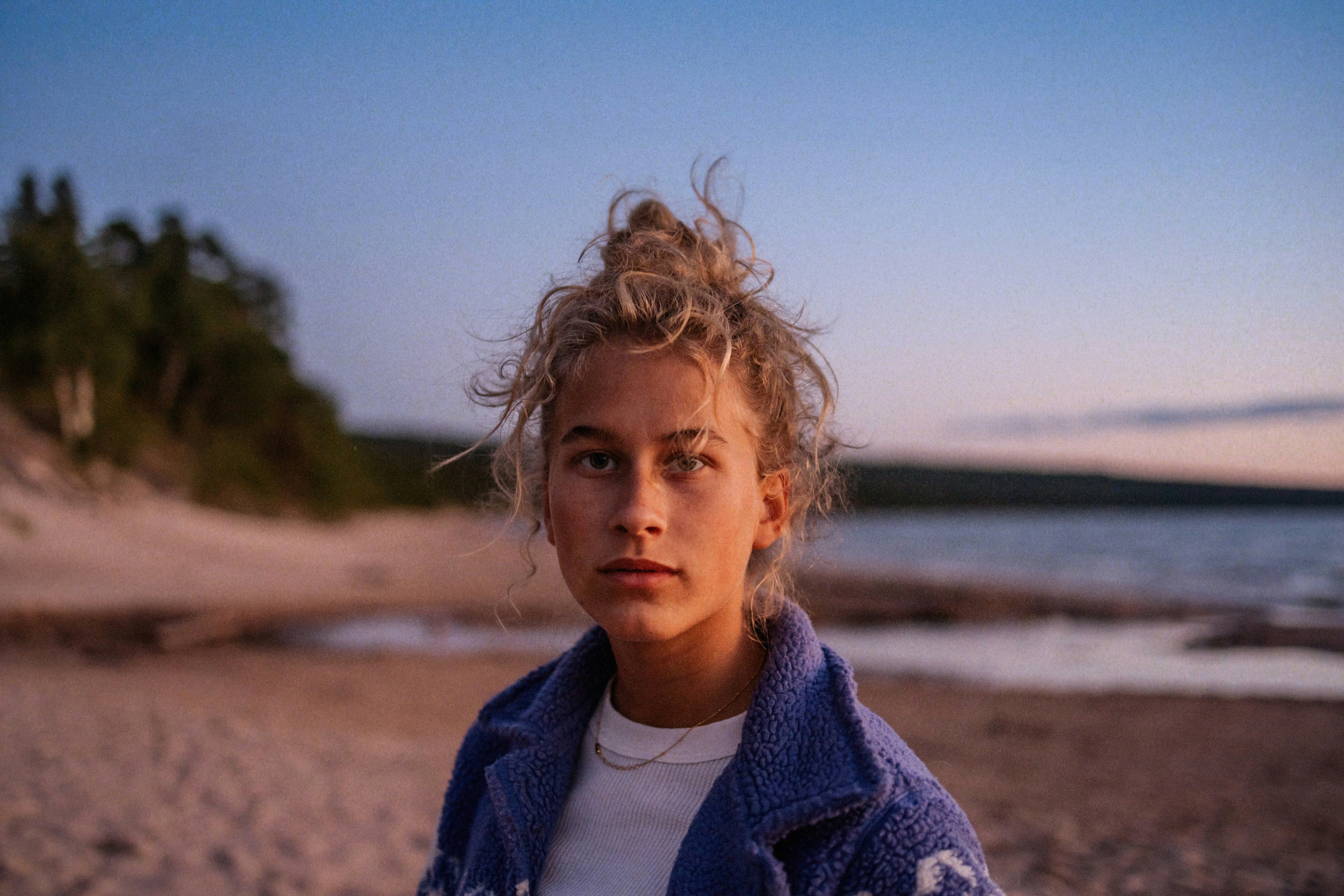 Blue Hour Quiet: Portrait of a Girl on a Wind-Washed Beach