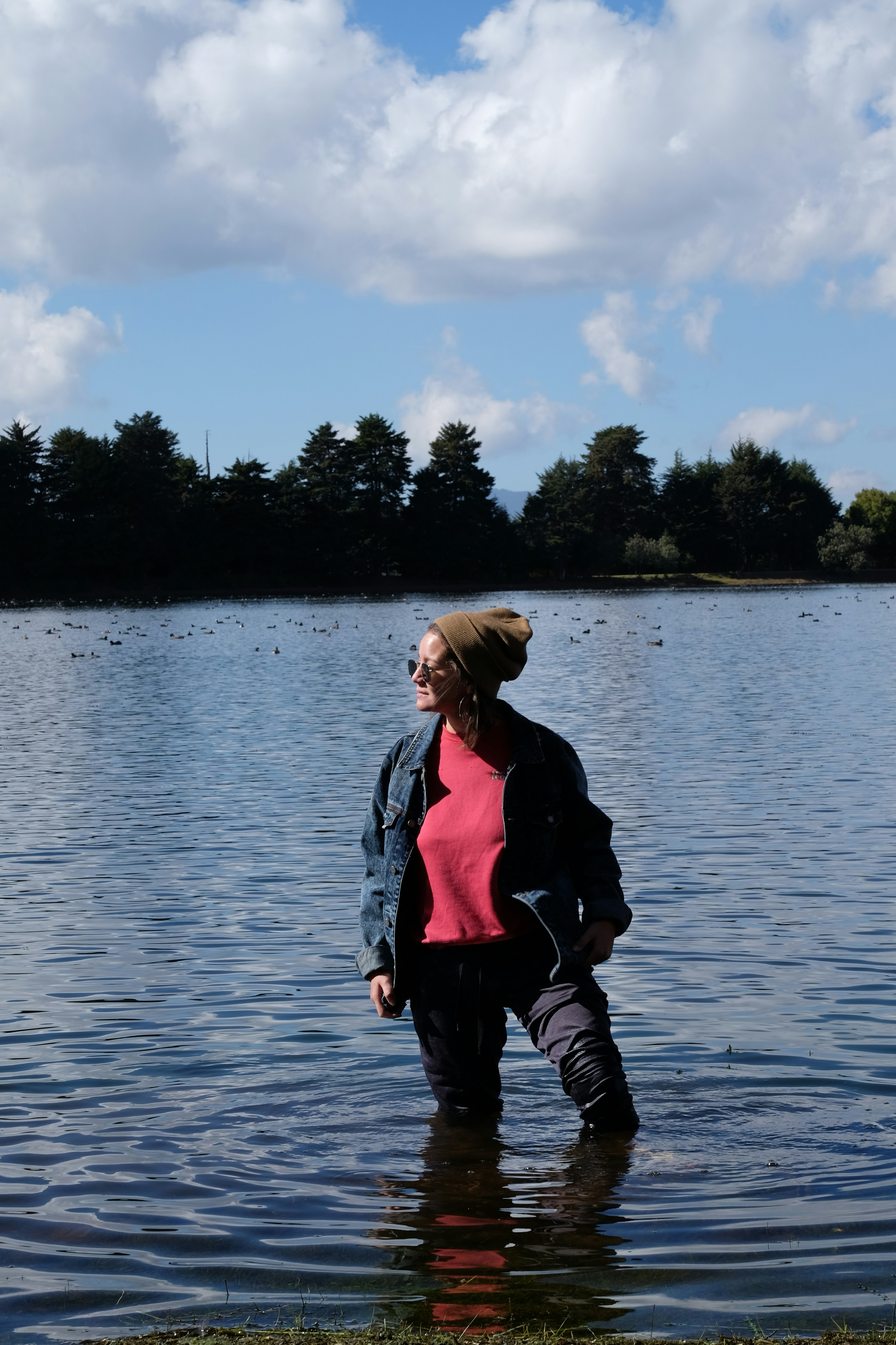 A person standing in water photo – Free Clothing Image on Unsplash