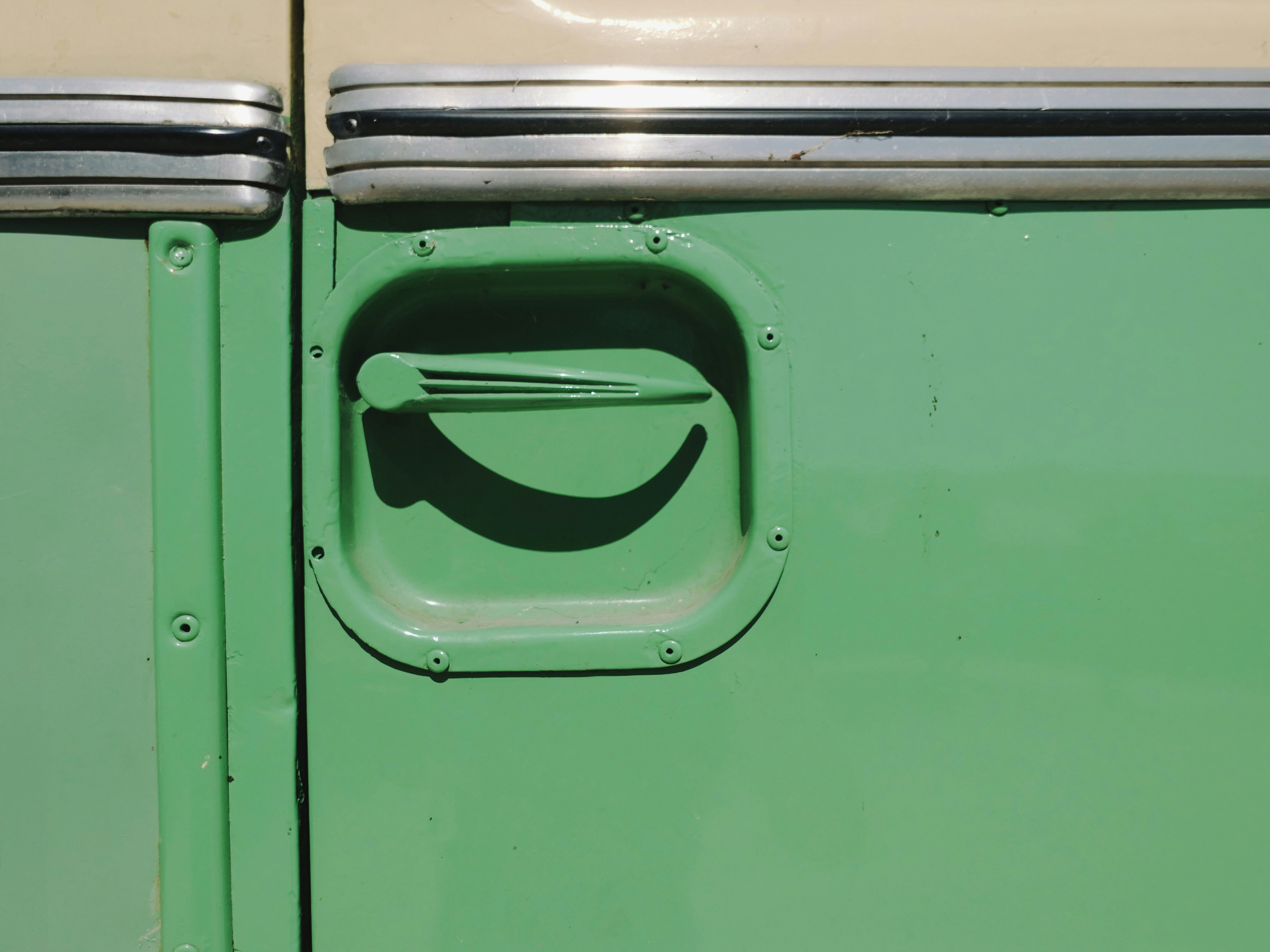 a green door with a green handle