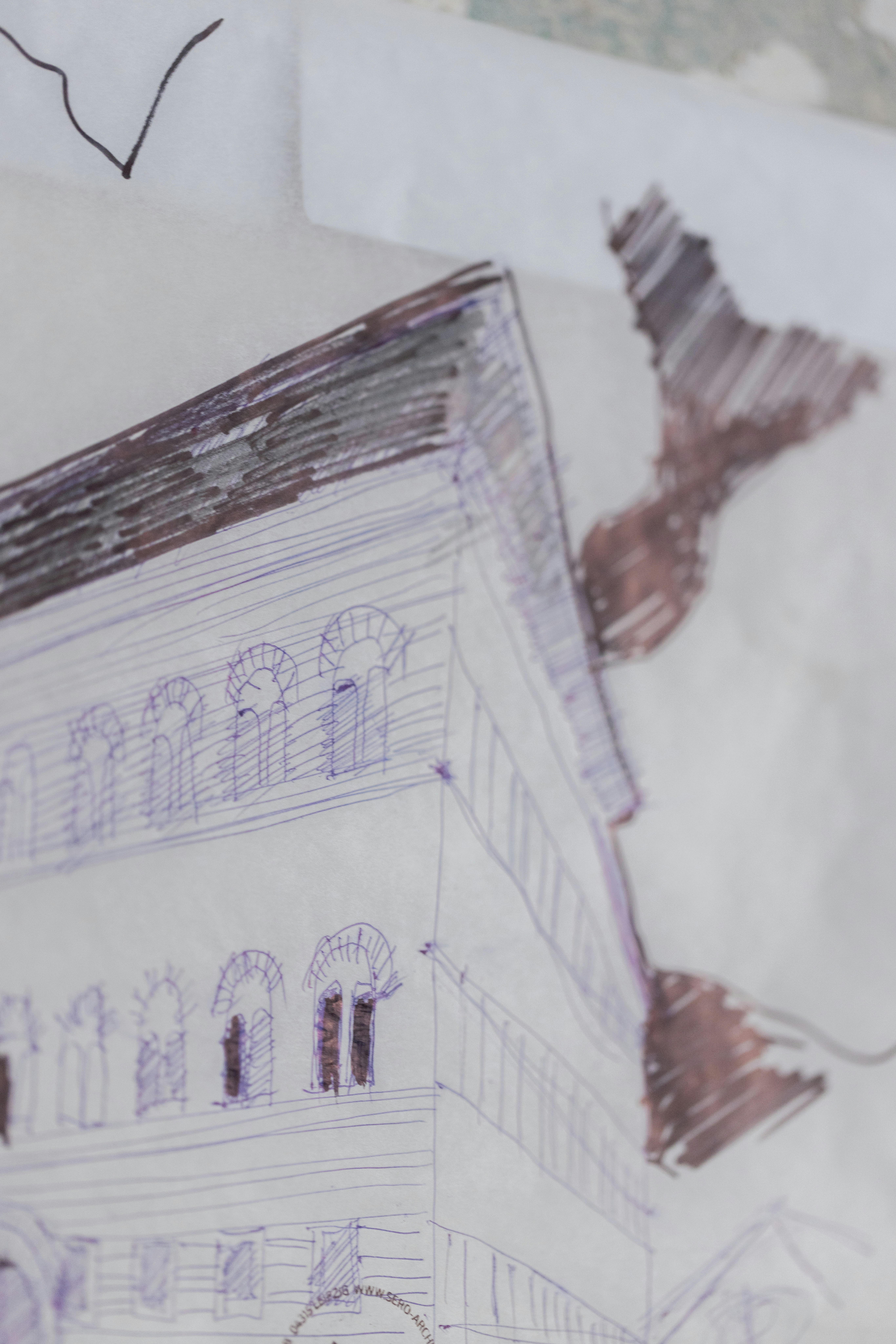 Architectural sketch on textured paper: a tilted perspective of a classical building details