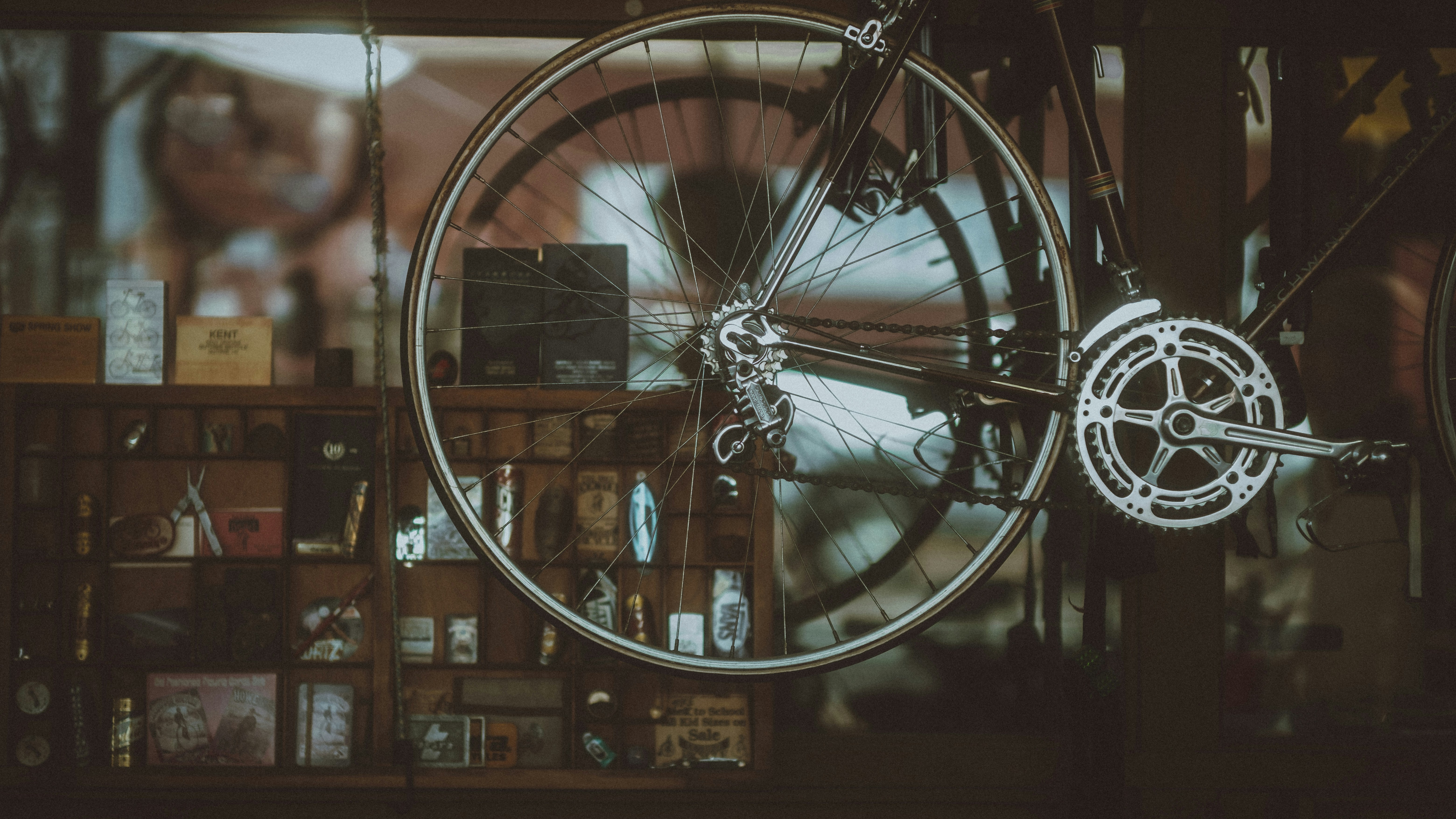 A bicycle wheel in a room photo – Free Grey Image on Unsplash