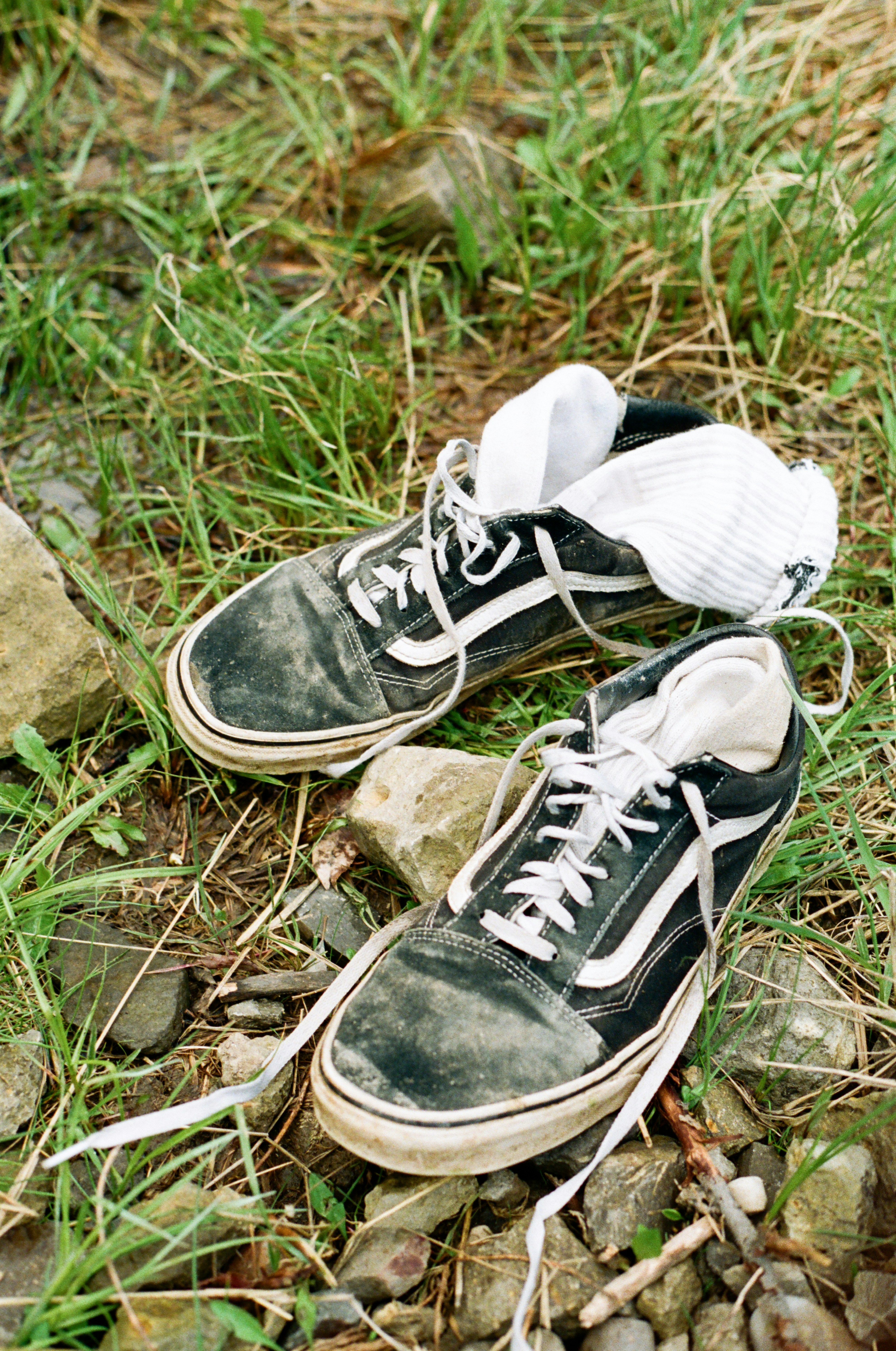 A pair of sneakers on the ground photo – Free Shoe Image on Unsplash