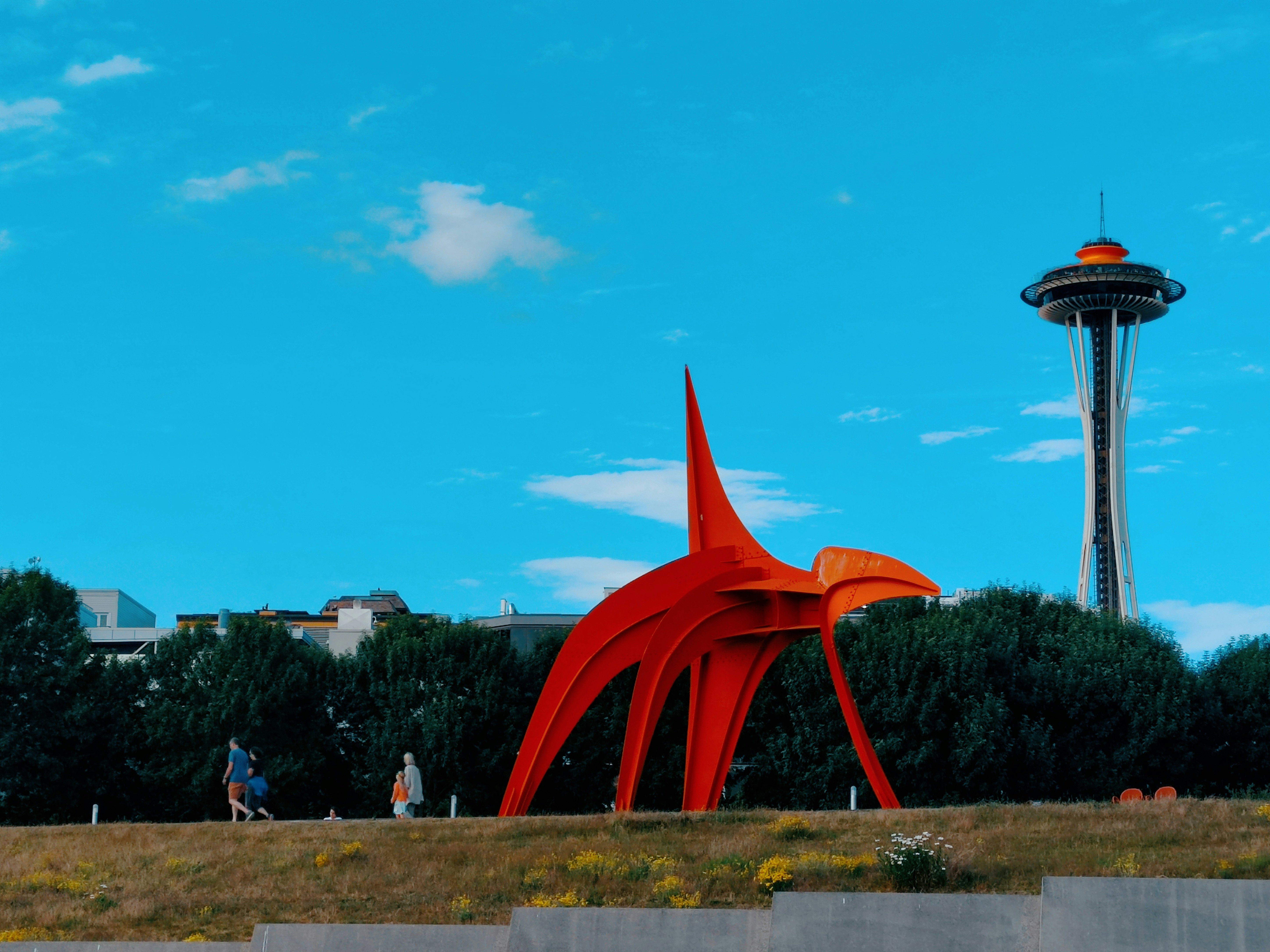 A red sculpture in front of a tower photo – Free Seattle Image on Unsplash