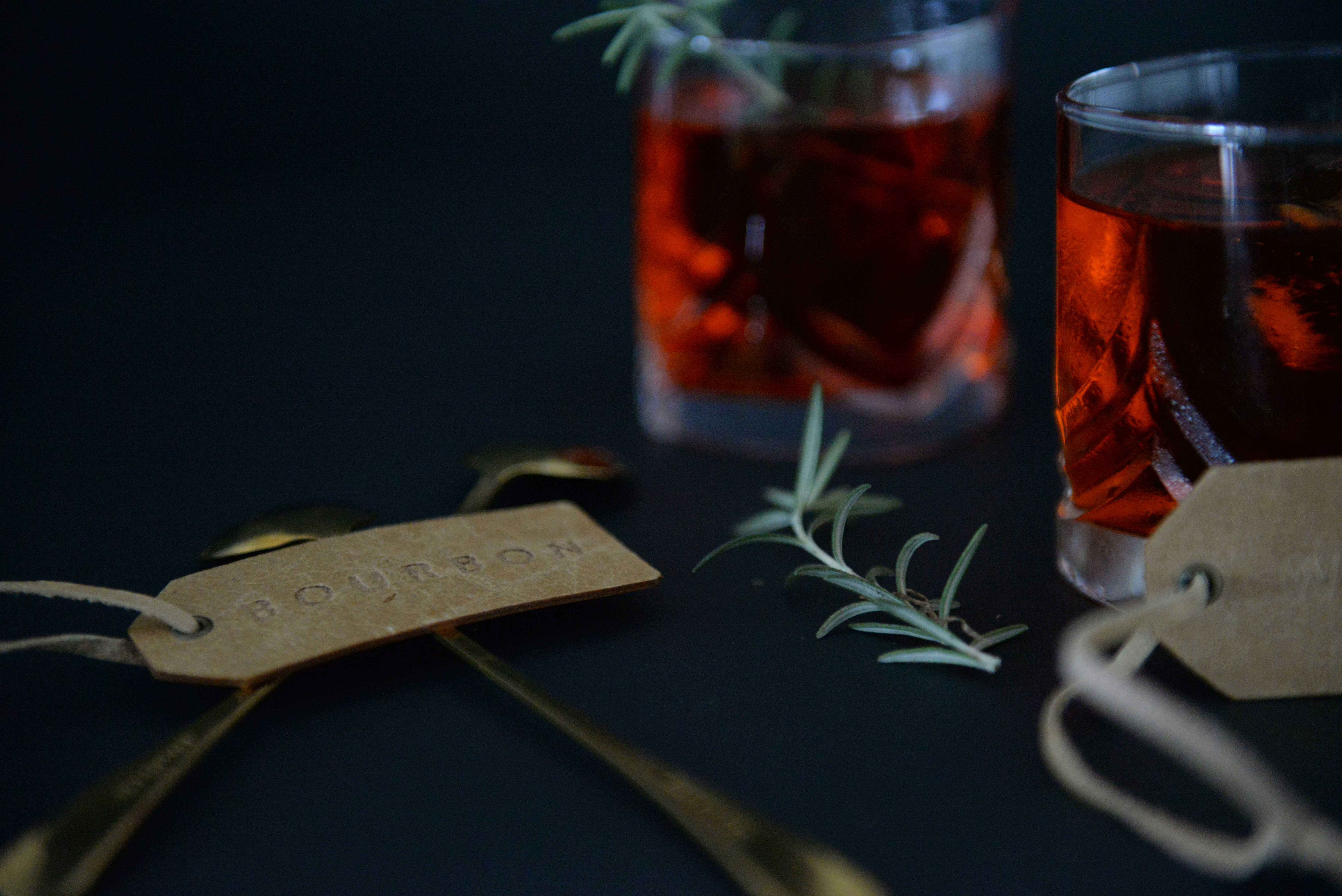 Copper-amber cocktails and rosemary accents