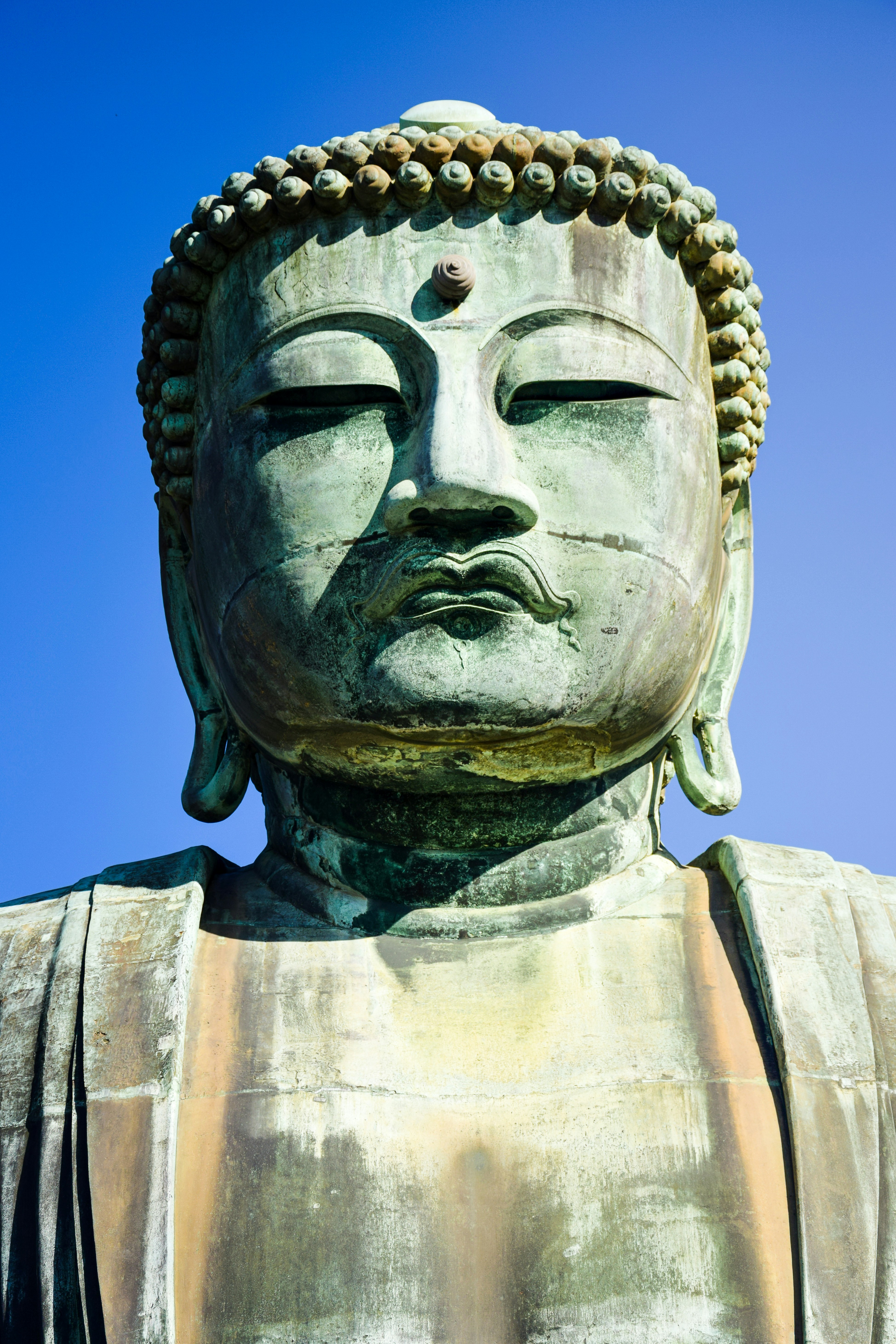 A statue of a person photo – Free Japan Image on Unsplash