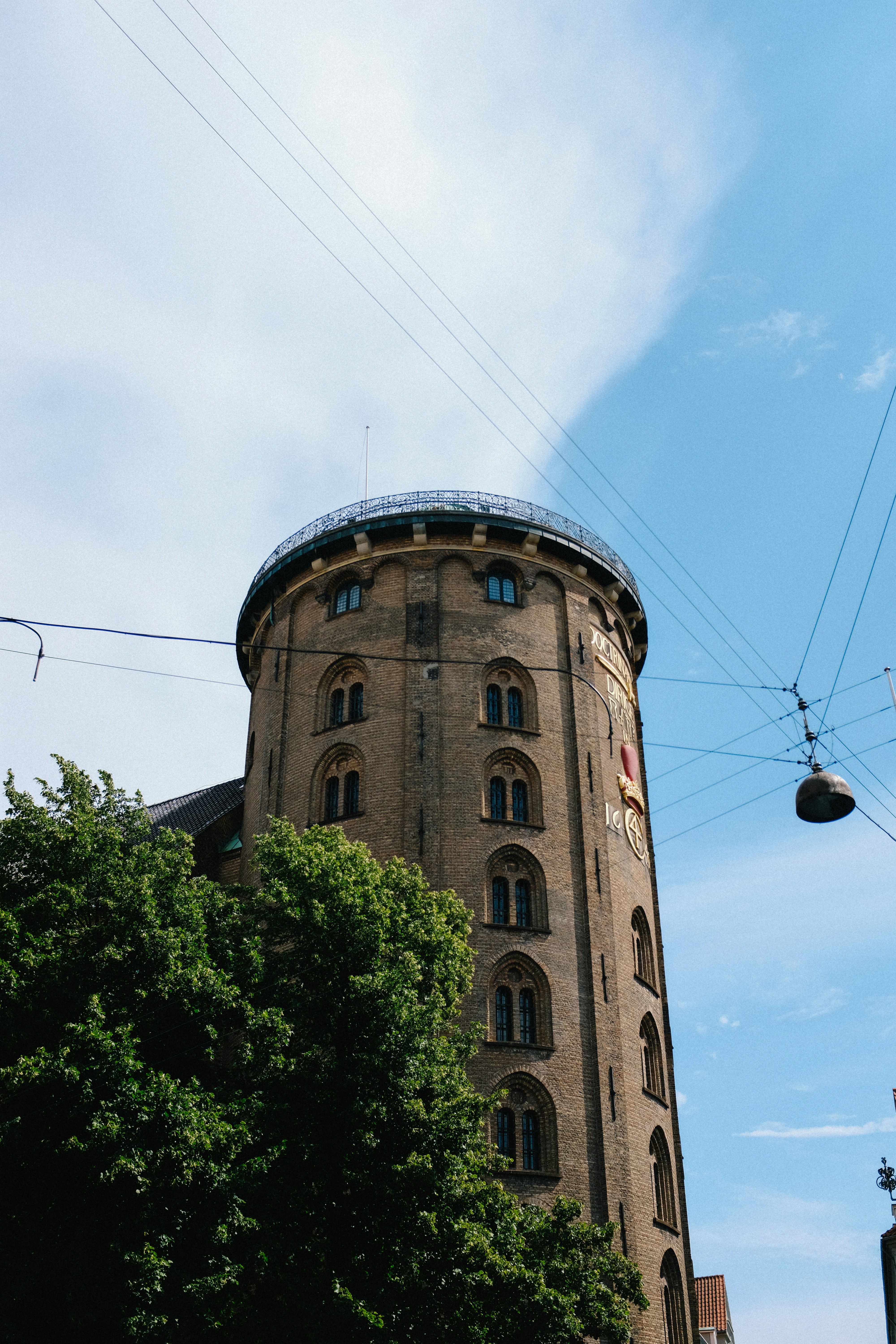 a tall brick building with a tower