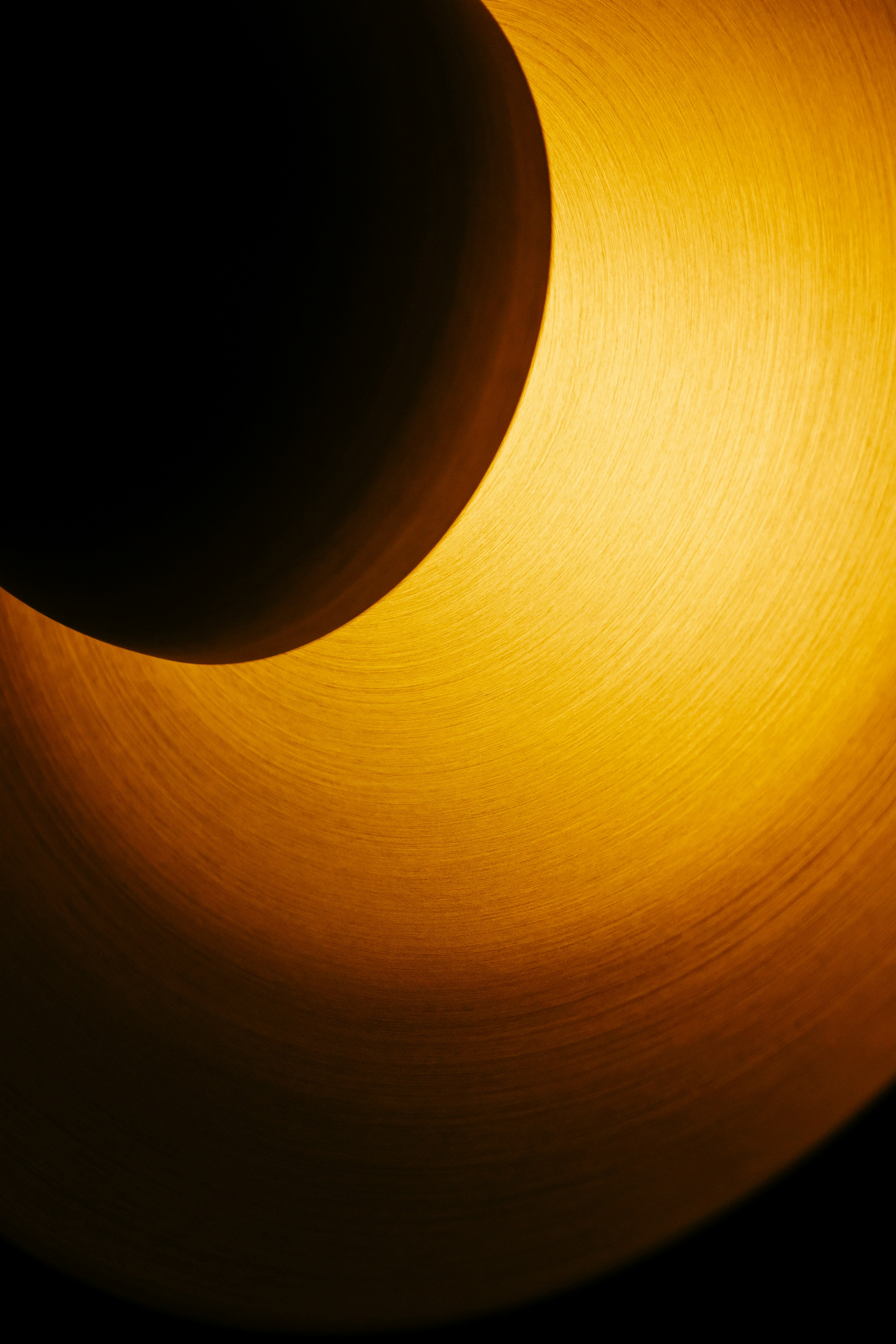 Brass Eclipse Over a Radiant Golden Spiral