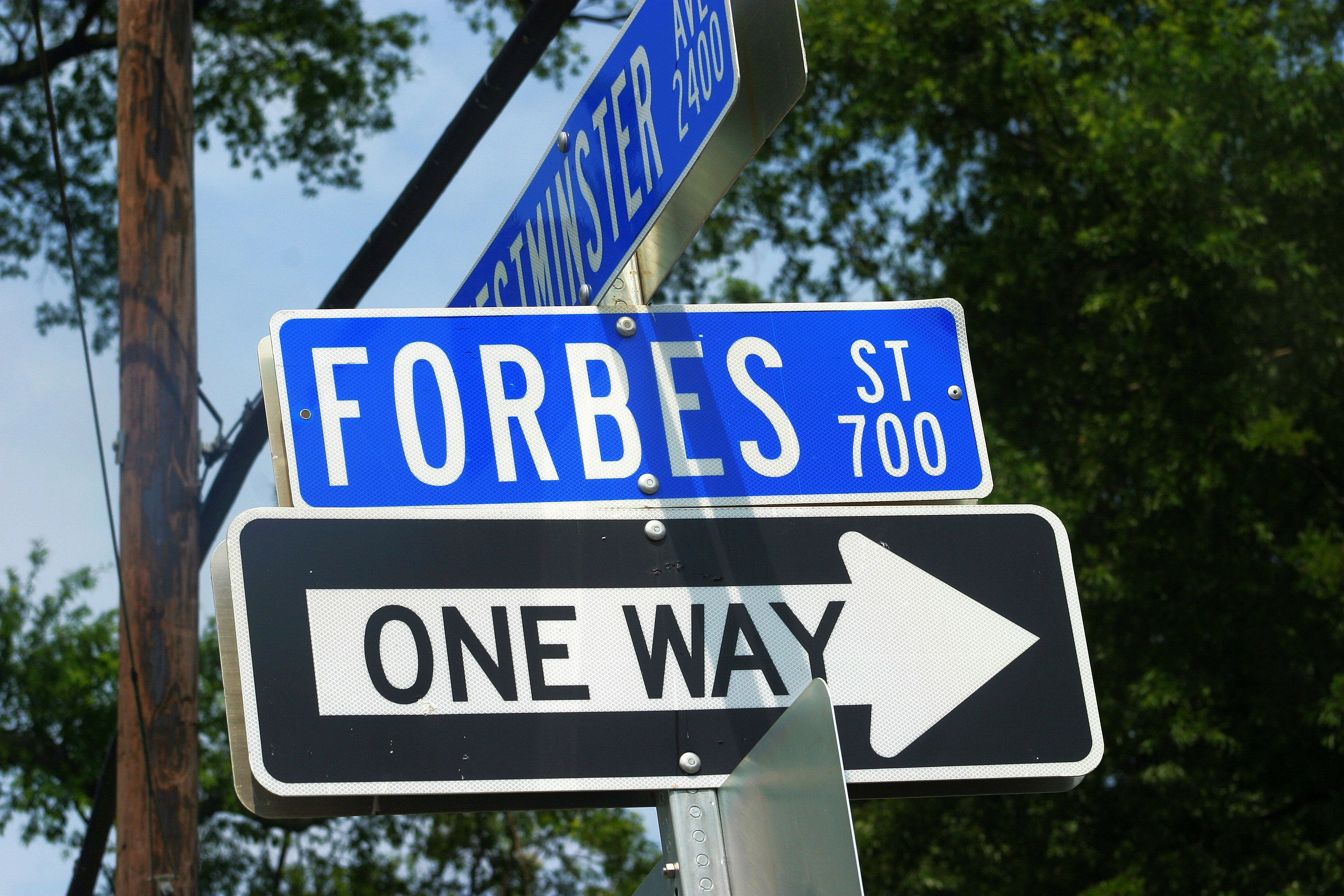 A street sign with a couple of street signs on it photo – Free Usa ...