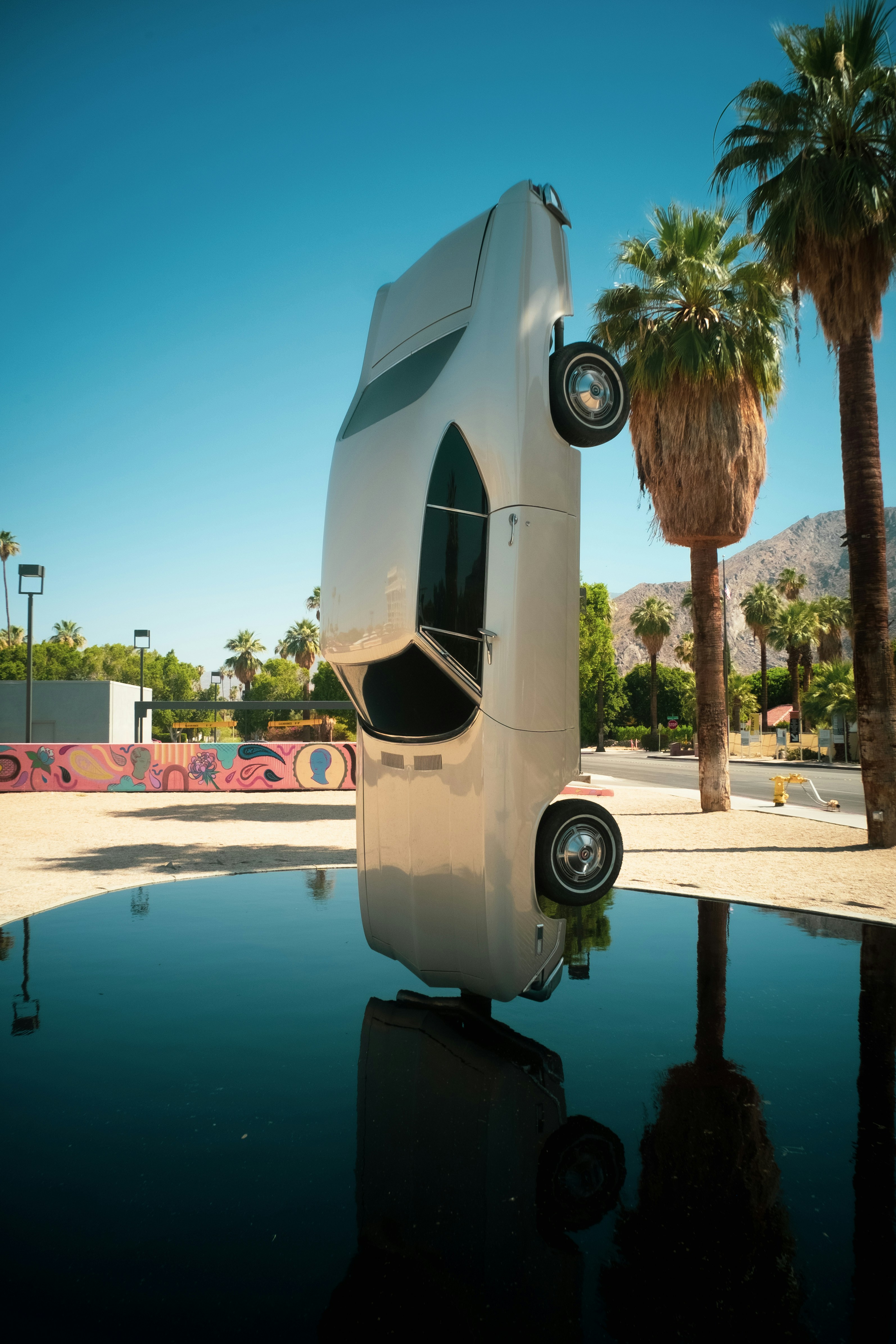 Upright Car Monument Reflected in a Desert Palm Oasis