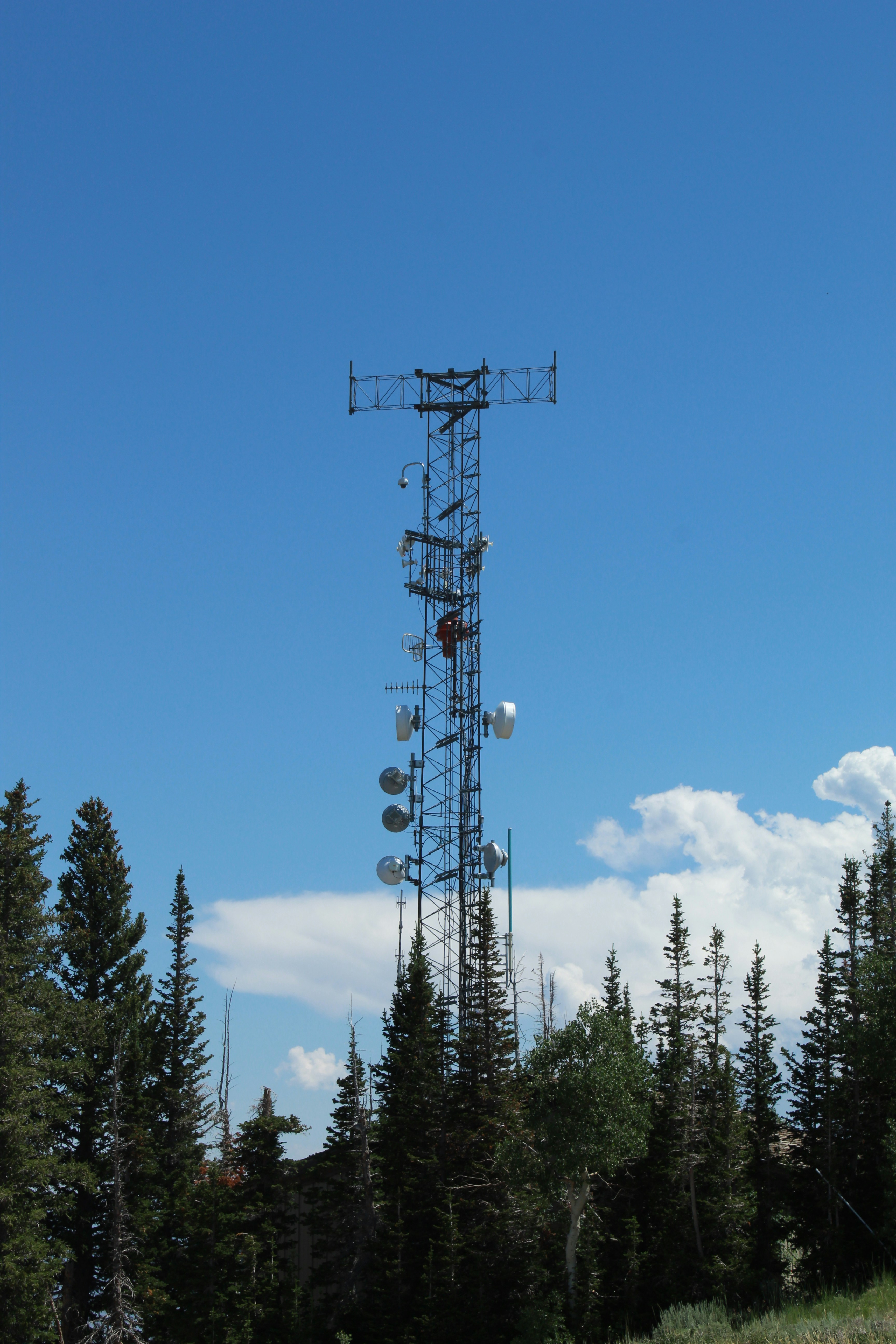Skyward Lattice: A Communication Tower Reaches Toward the Clear Blue